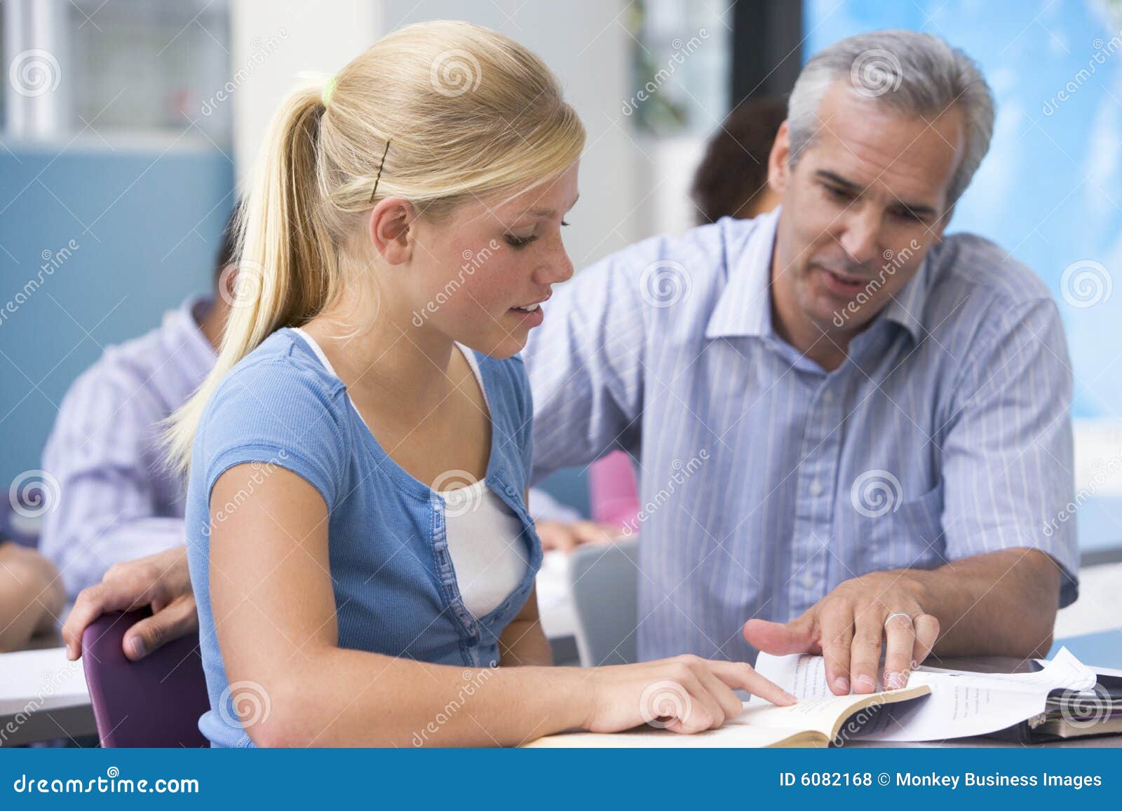 A Teacher Instructs a Schoolgirl Stock Photo - Image of lesson, color ...