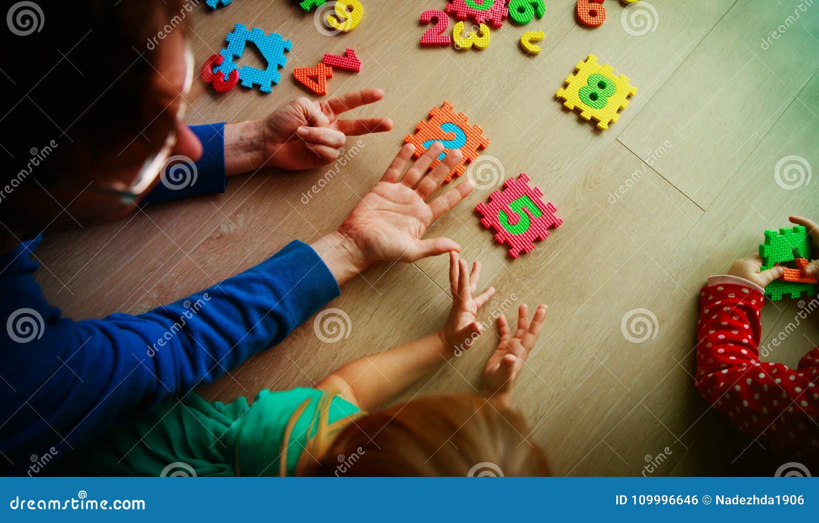 Teacher and Kids Play with Number Puzzle Stock Photo - Image of ...
