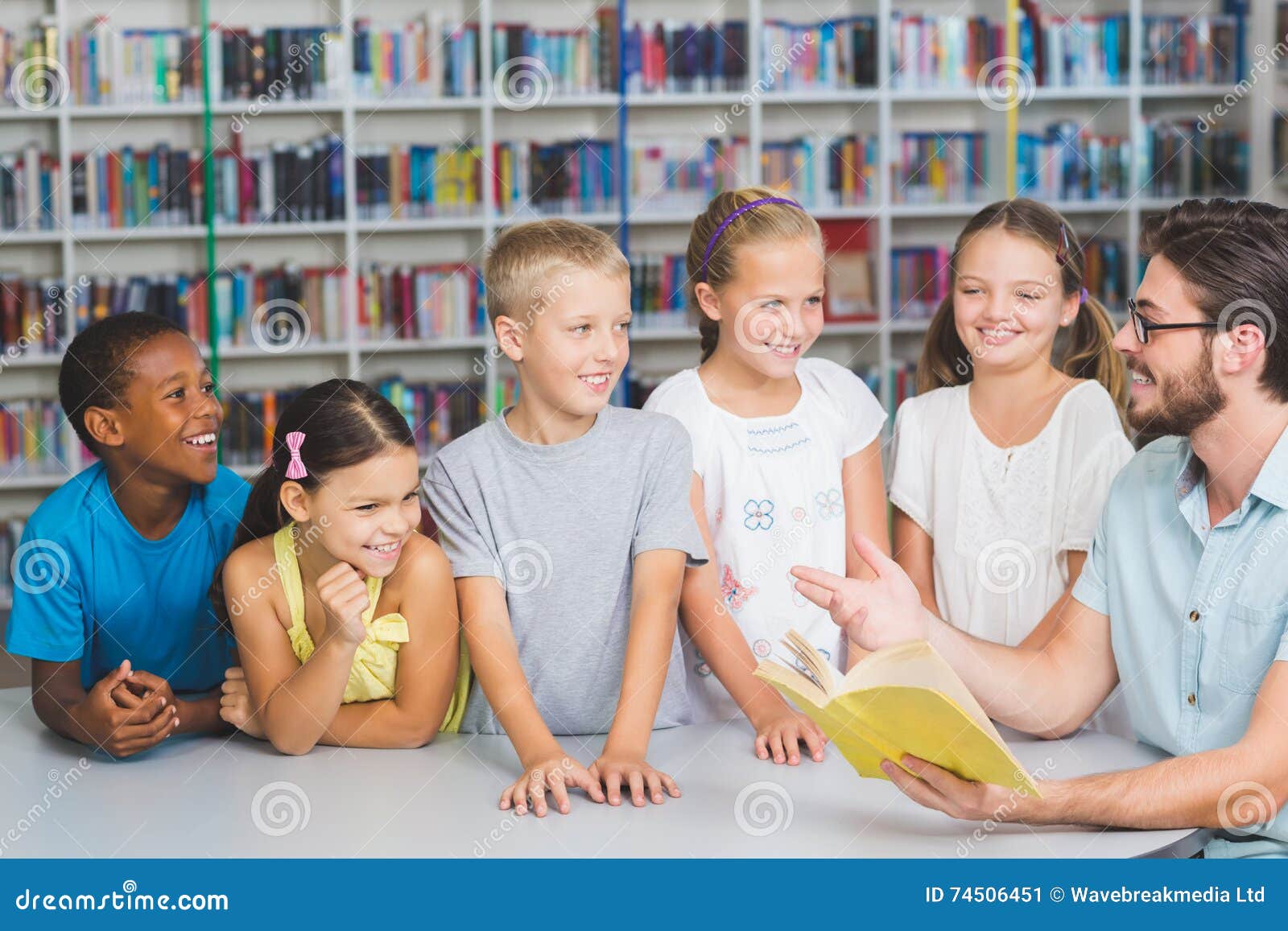 Teacher and Kids Reading Book in Library Stock Image - Image of ...
