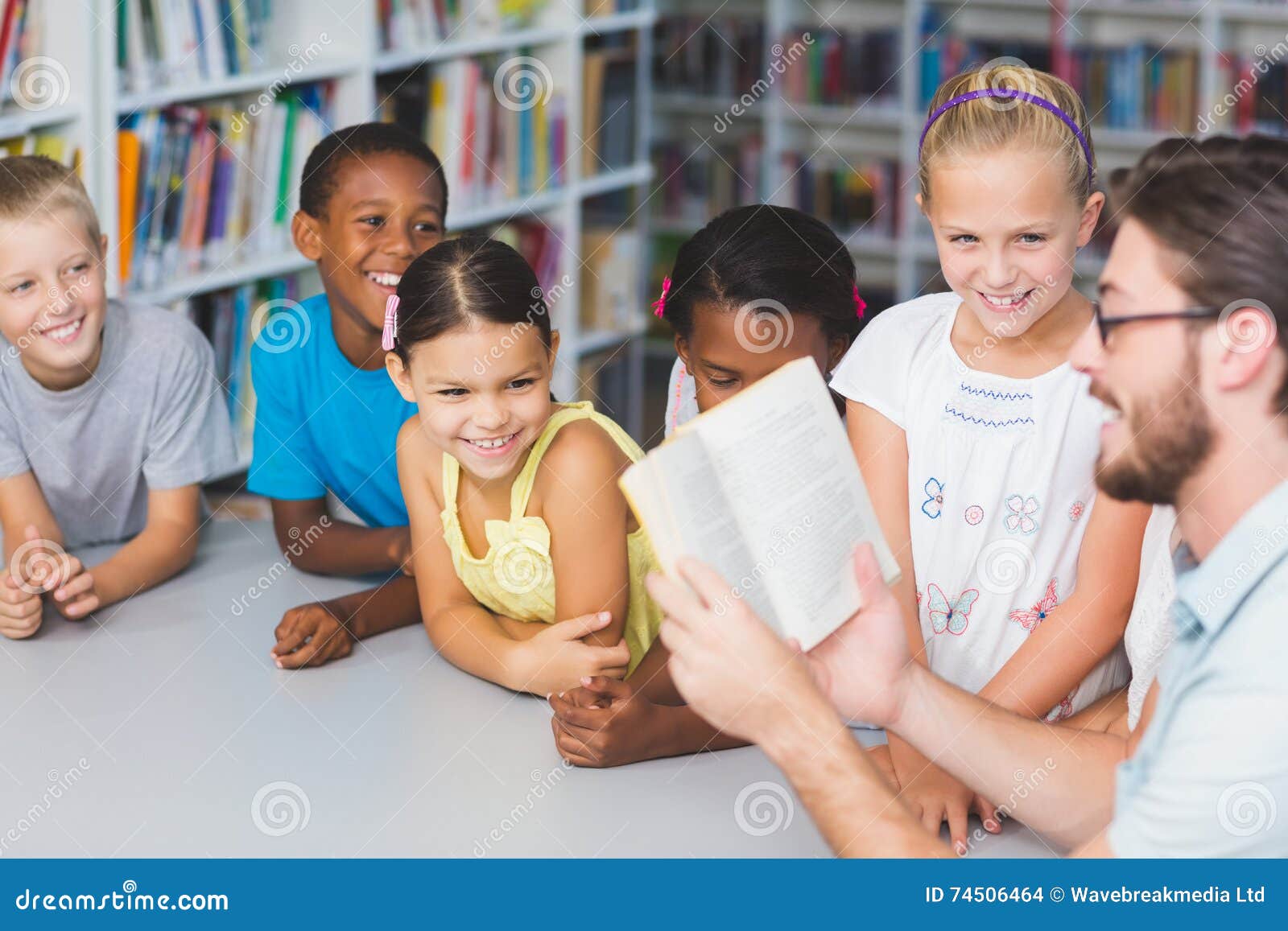 Teacher and Kids Reading Book in Library Stock Photo - Image of happy ...