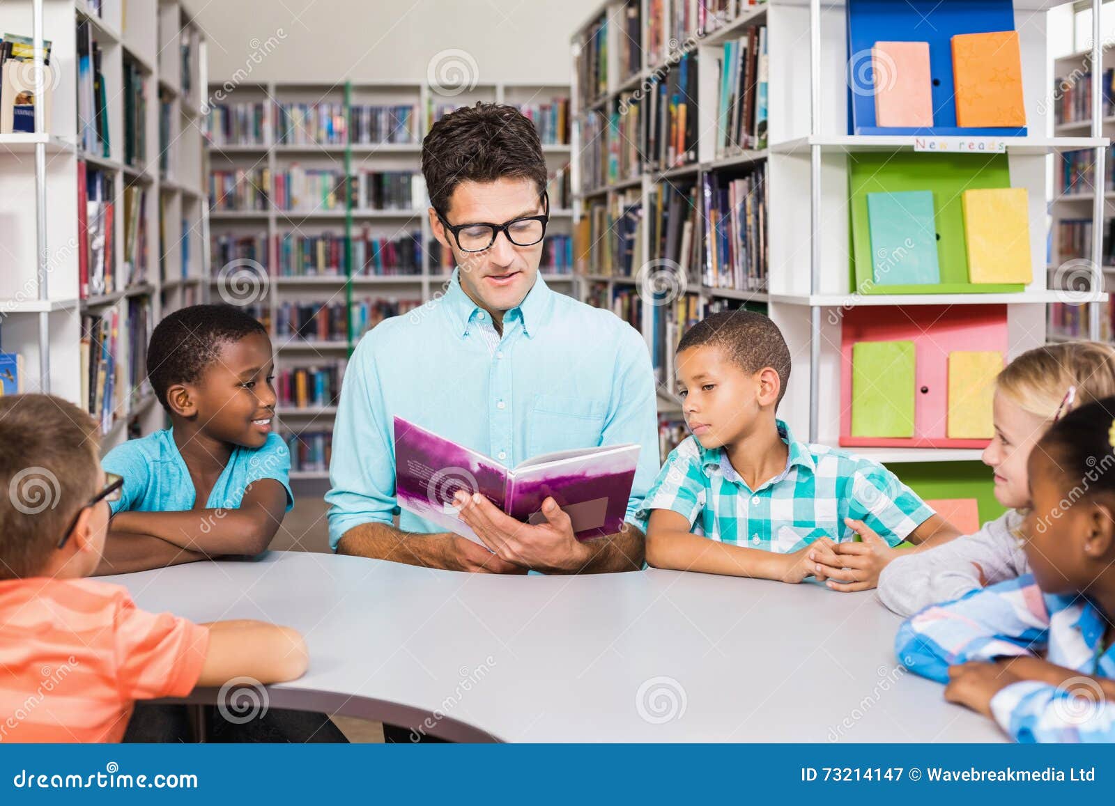 Teacher and Kids Reading Book in Library Stock Image - Image of male ...