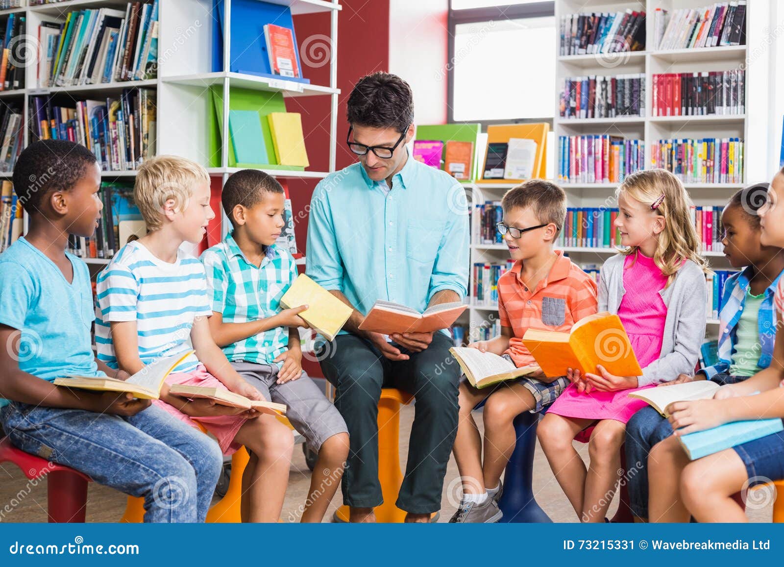 Teacher and Kids Reading Book in Library Stock Image - Image of ...
