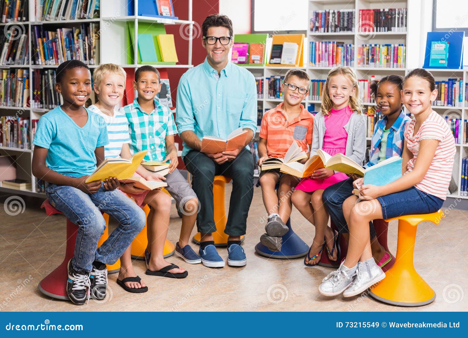Teacher and Kids Sitting in Library Stock Image - Image of caucasian ...