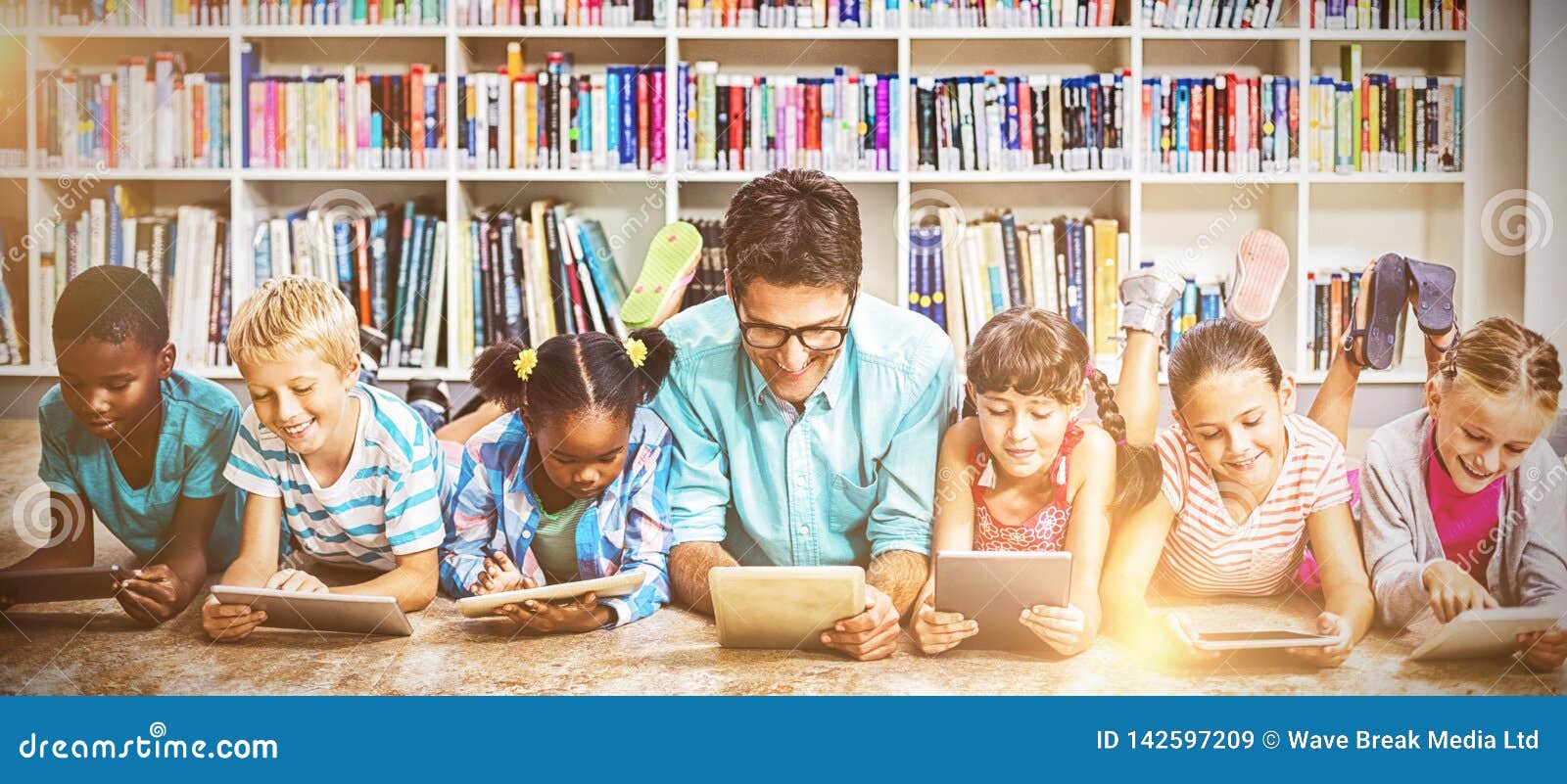 Teacher and Kids Using Digital Tablet in Library Stock Image - Image of ...