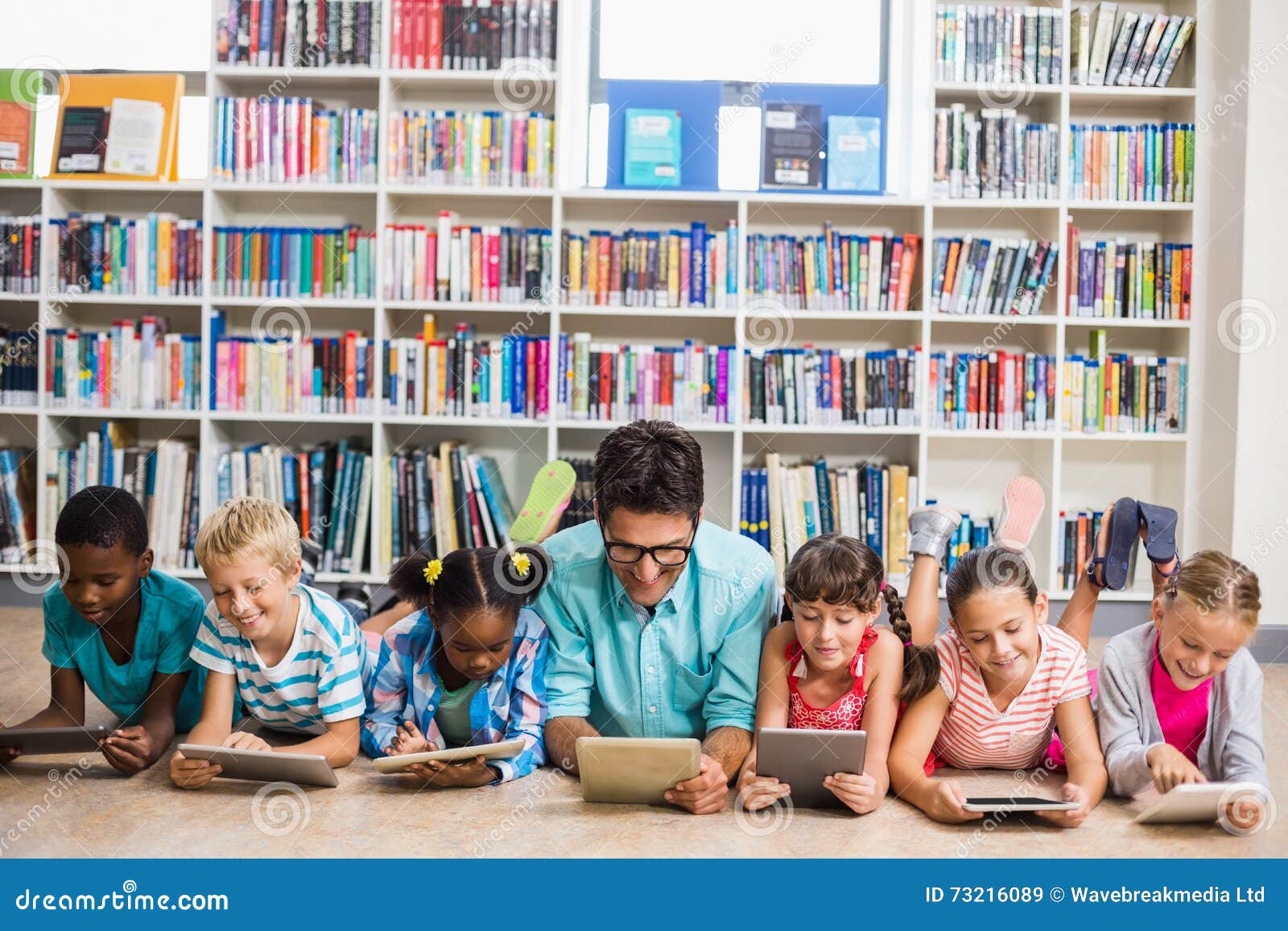 Teacher and Kids Using Digital Tablet in Library Stock Image - Image of ...