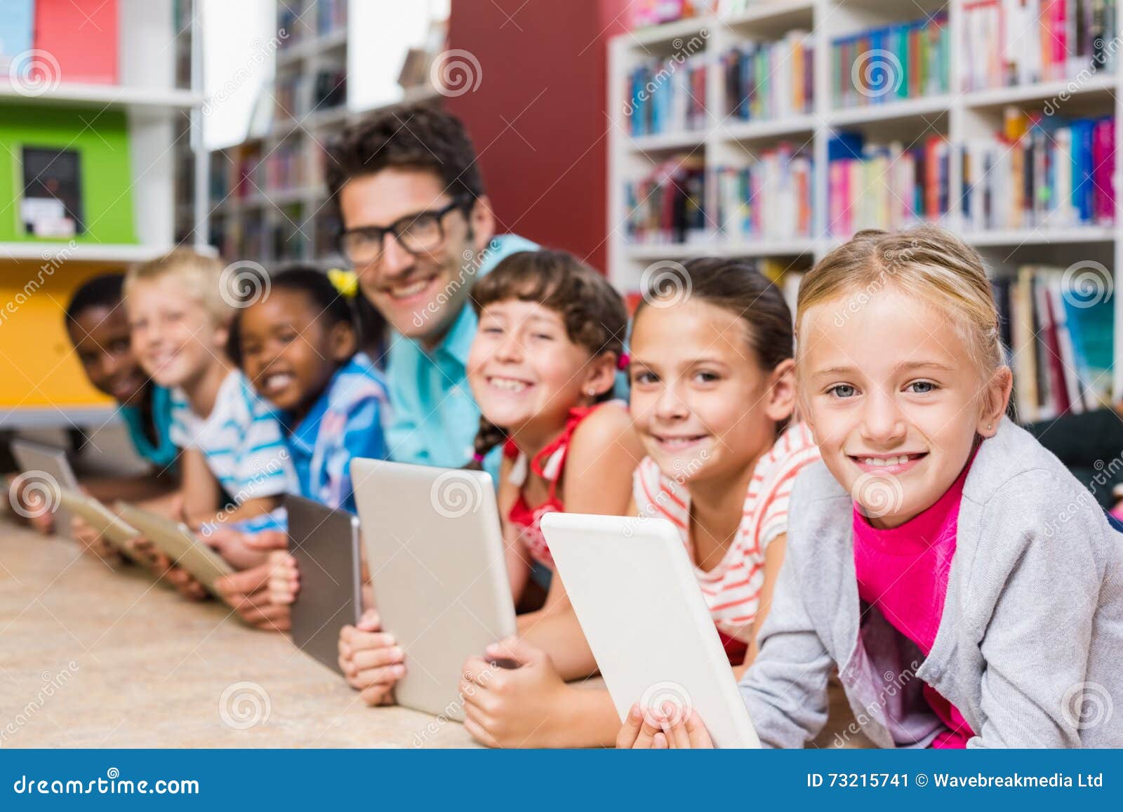 Teacher and Kids Using Digital Tablet in Library Stock Image - Image of ...