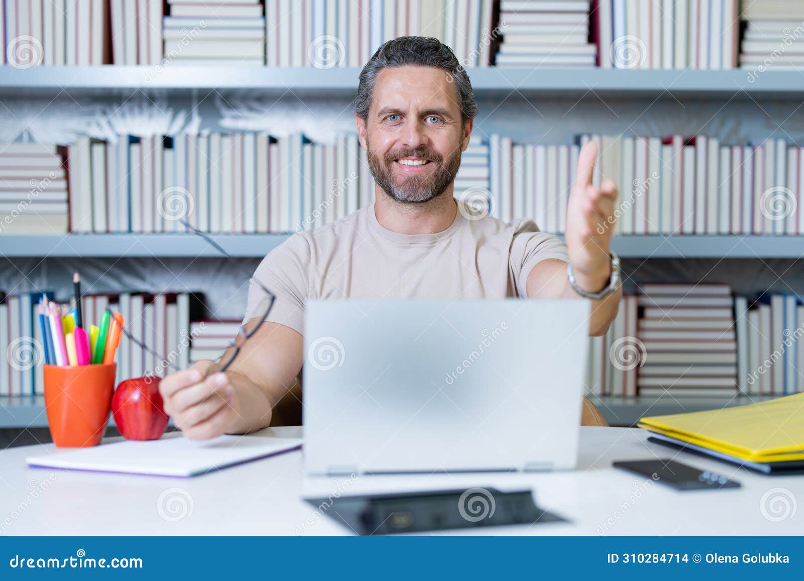 Teacher with Laptop in Library Classroom. Handsome Teacher Work on ...