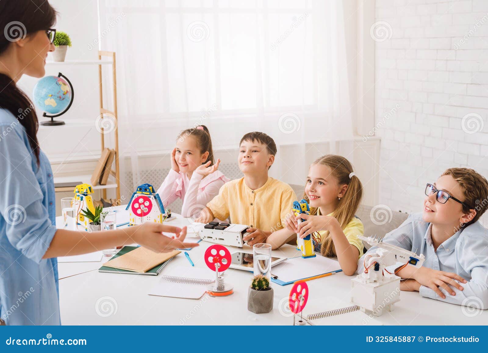 Teacher Leading Elementary School Students in STEM Activity Stock Image ...