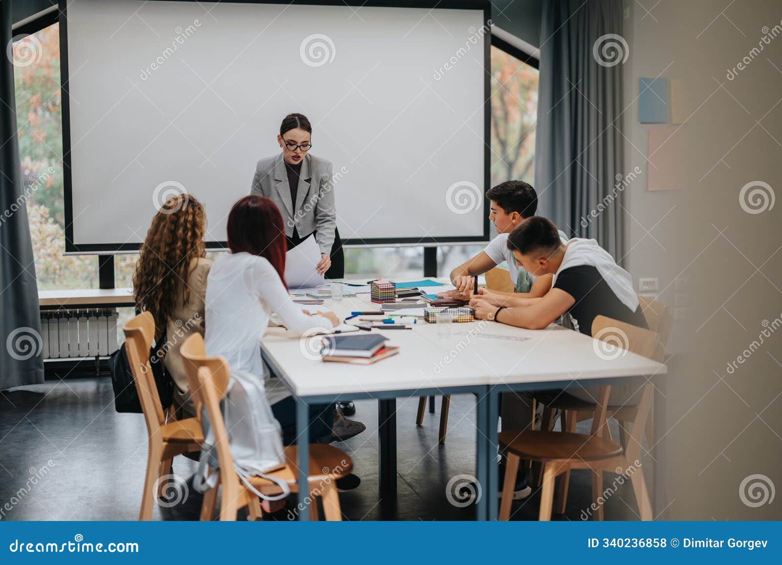 Teacher Leading Interactive Classroom Discussion with Attentive ...