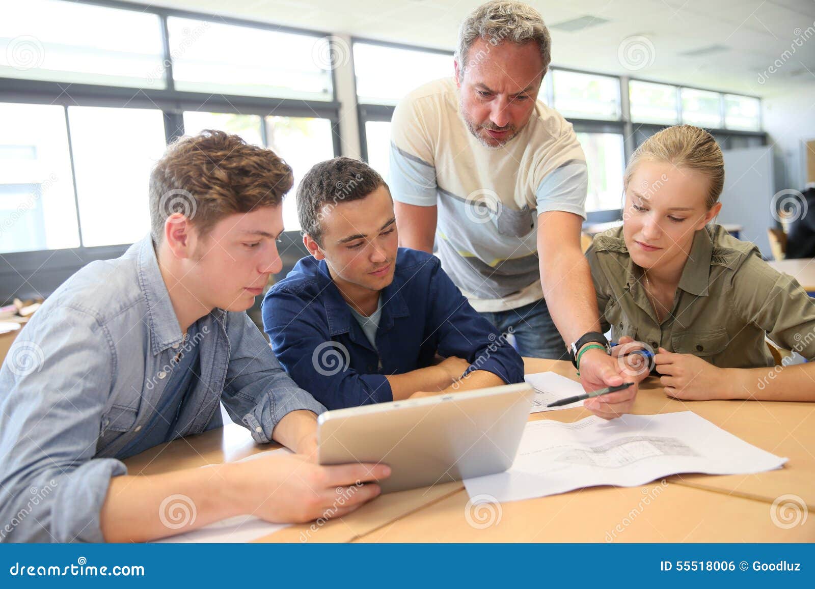 Teacher Learning Skills To Group of Students Stock Photo - Image of ...