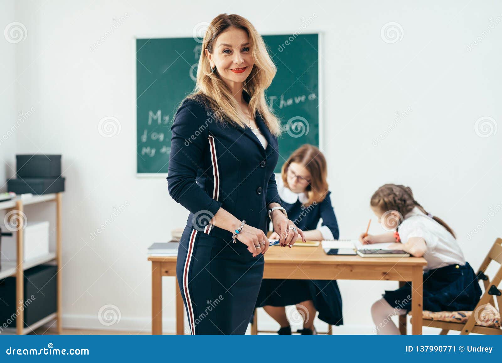 Teacher Looking at Camera Standing in Classroom Stock Image - Image of ...