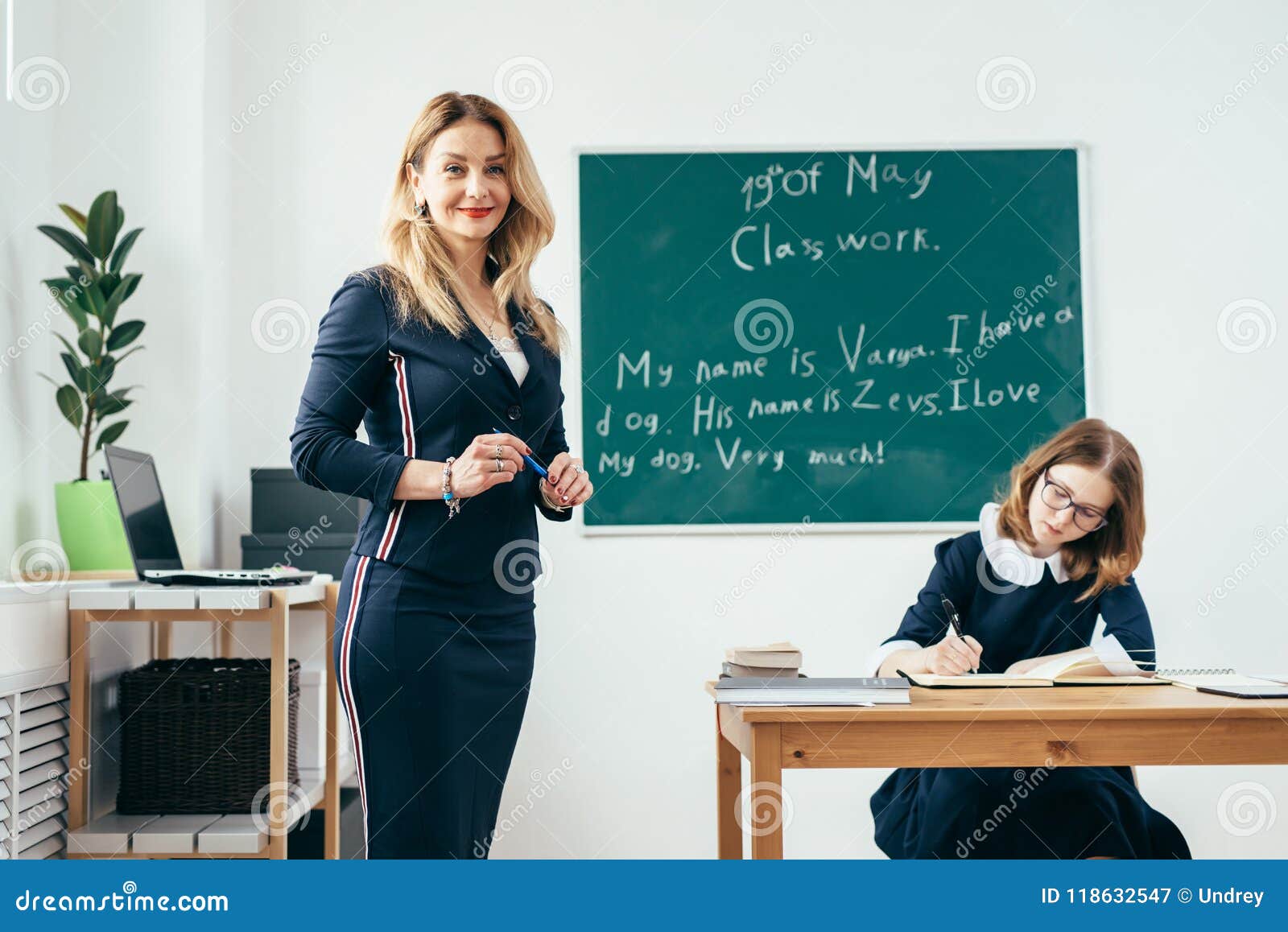 Teacher Looking at Camera Standing in Classroom Stock Image - Image of ...