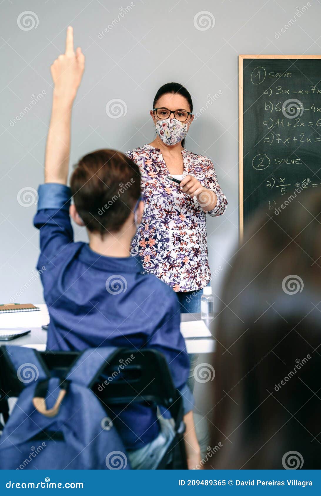 Teacher with Mask in Math Class with Student Raising Hand Stock Image ...