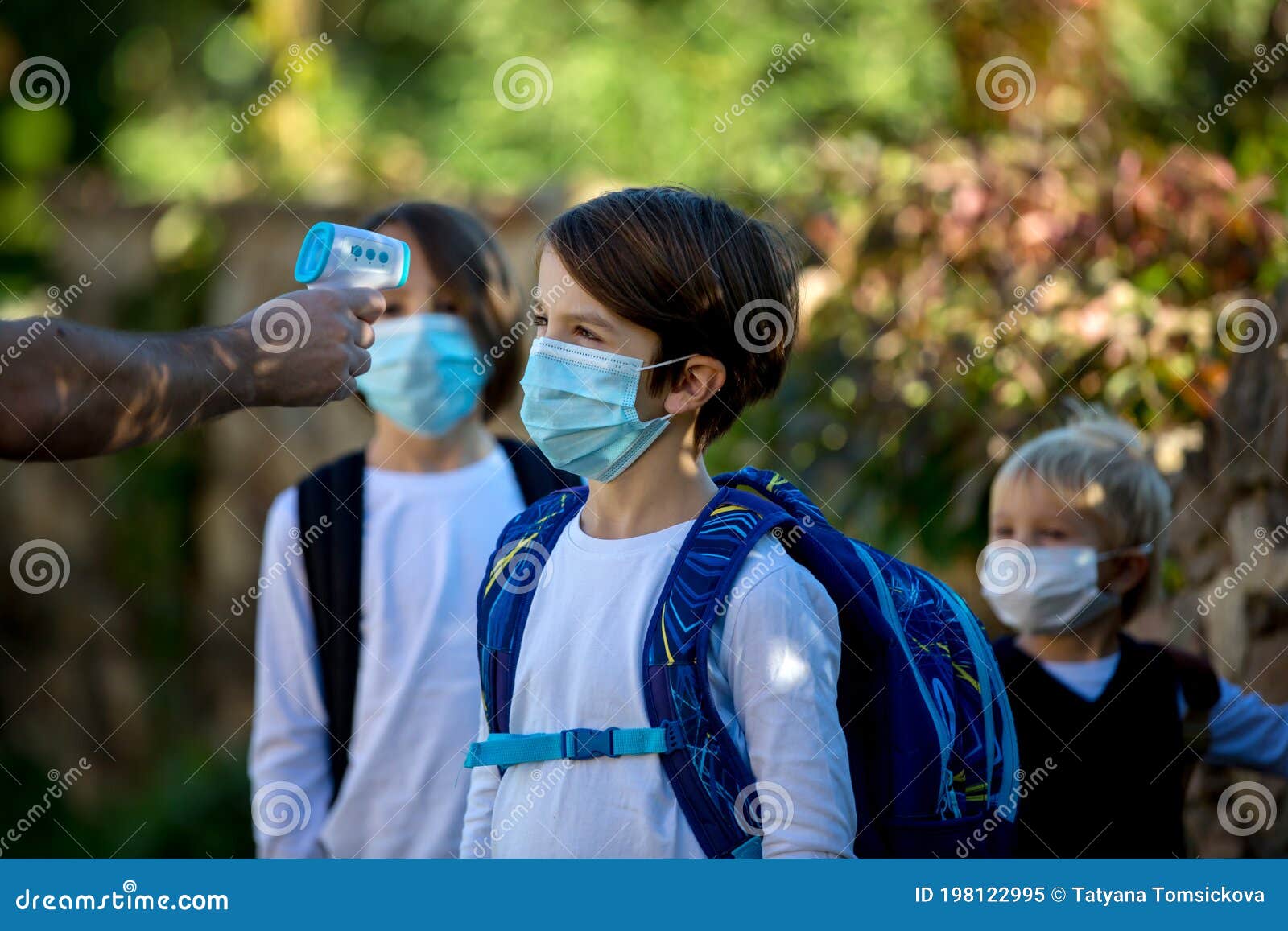 Teacher or Medical Person, Controlling Temperature and Doing Medical ...