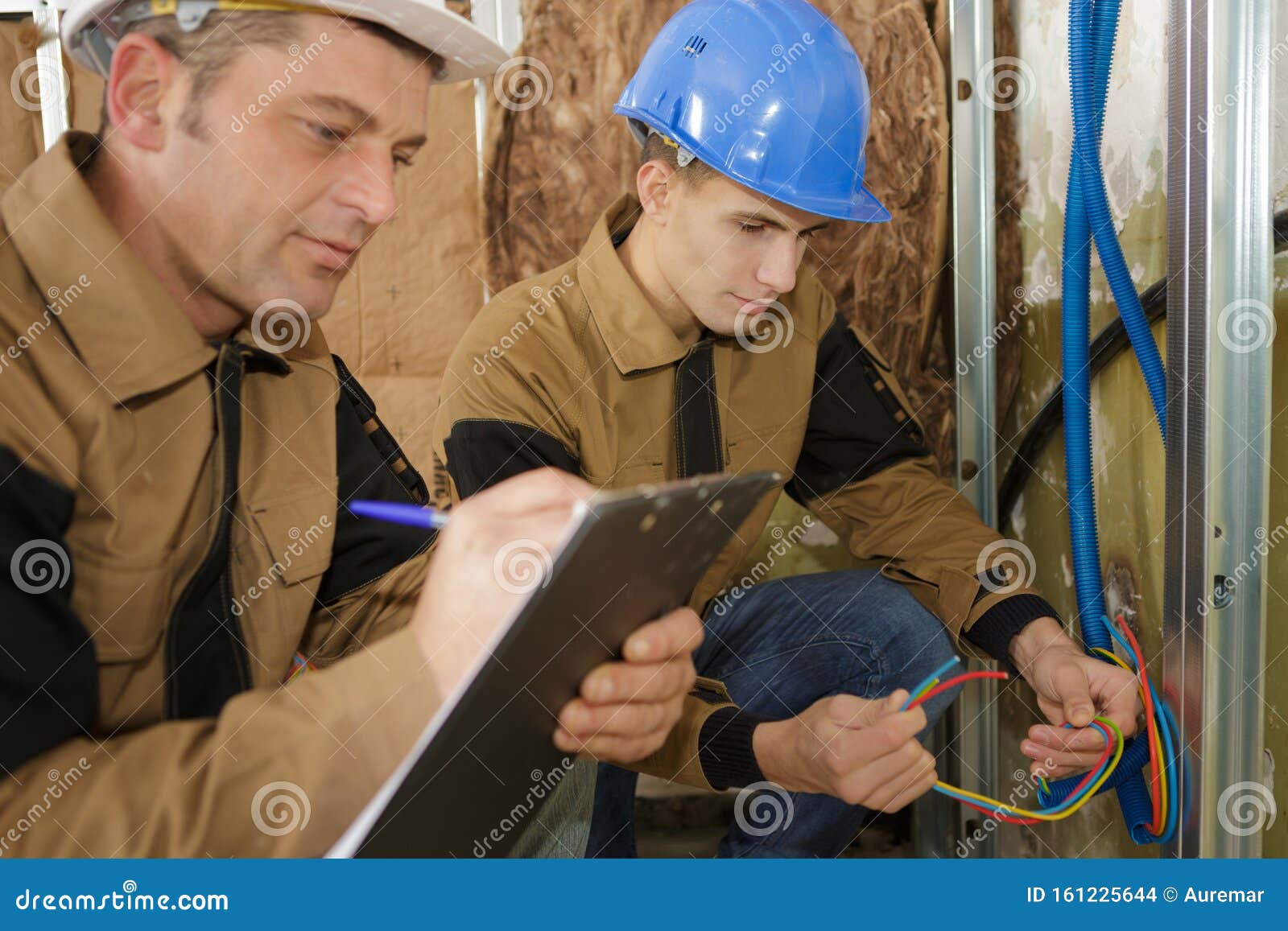 Teacher Observing Student Working on Electrical Circuits Stock Photo ...