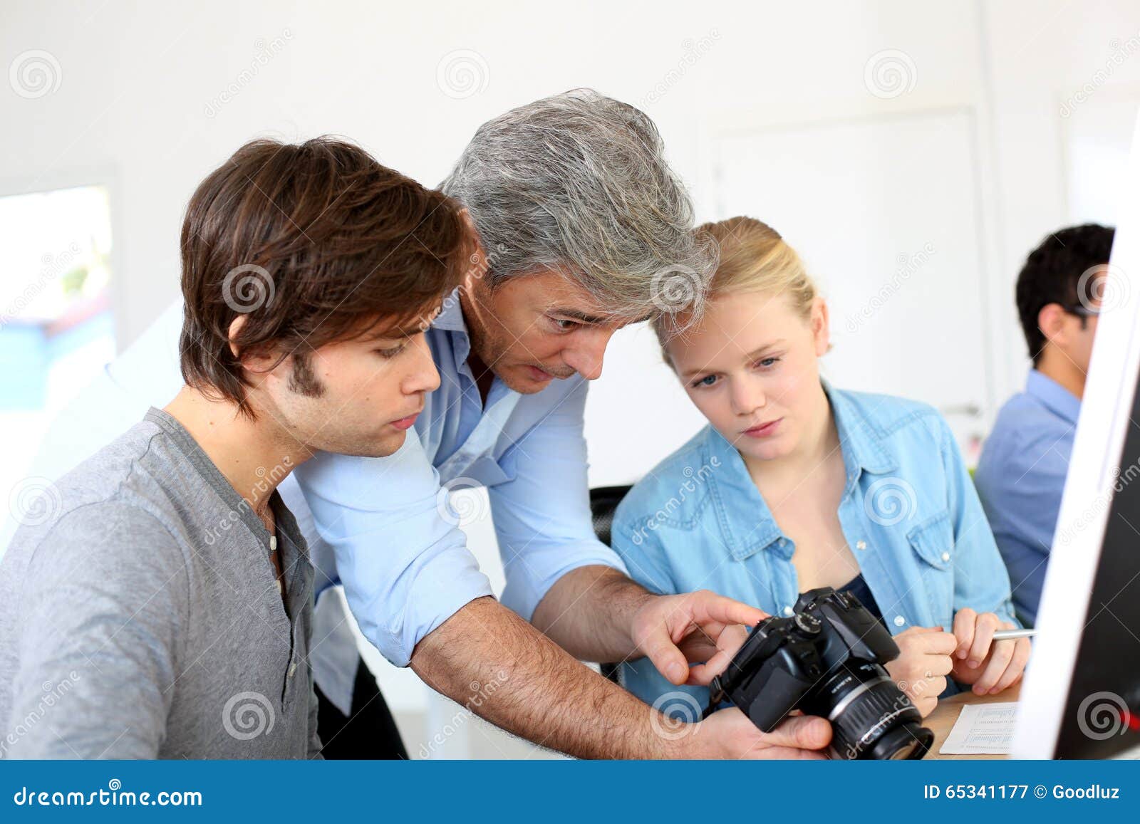 Teacher in Photography Class Showing Camera Stock Image - Image of ...