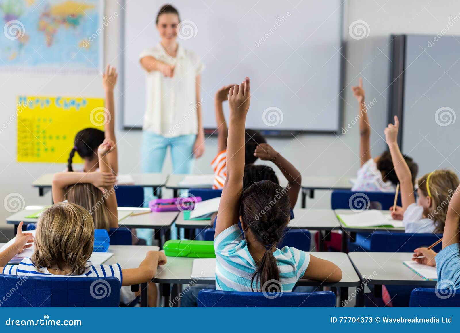 Teacher Pointing Students with Raised Hands Stock Image - Image of ...