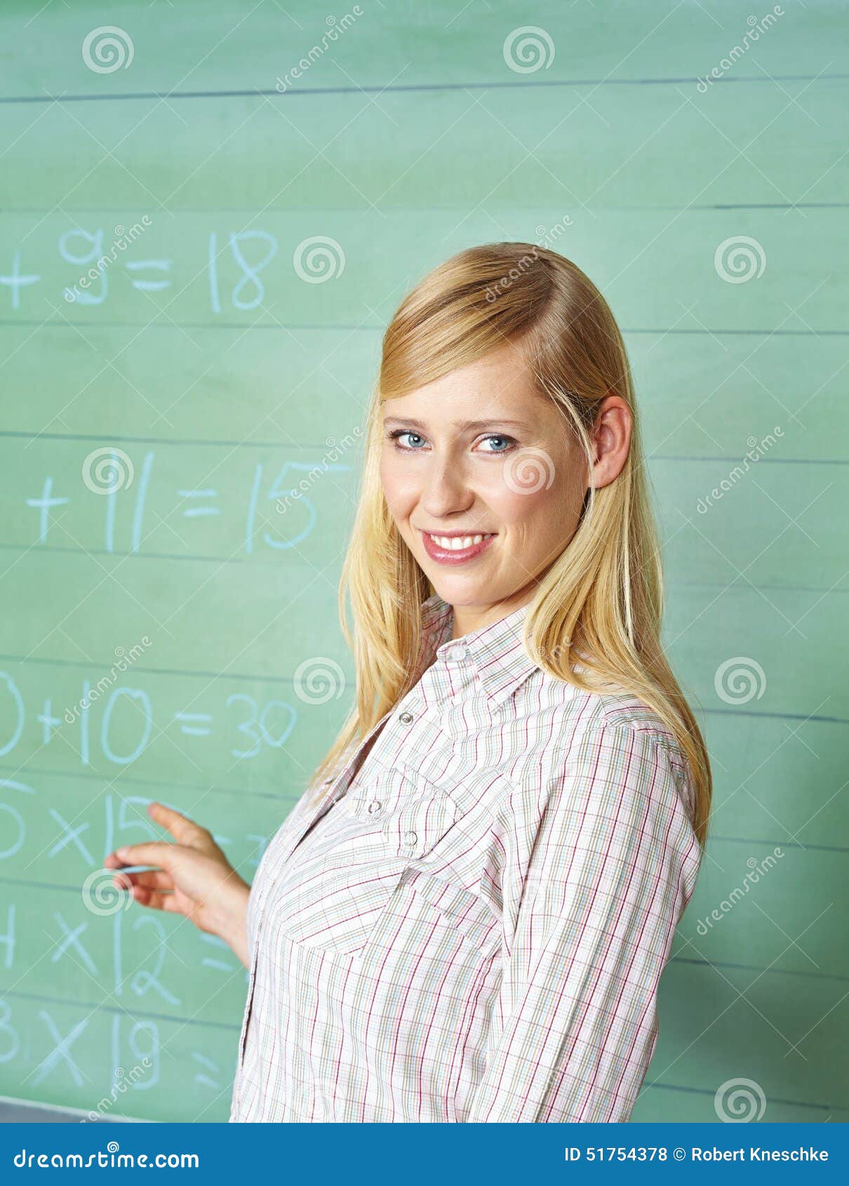 Teacher Pointing To Chalkboard in School Stock Photo - Image of work ...