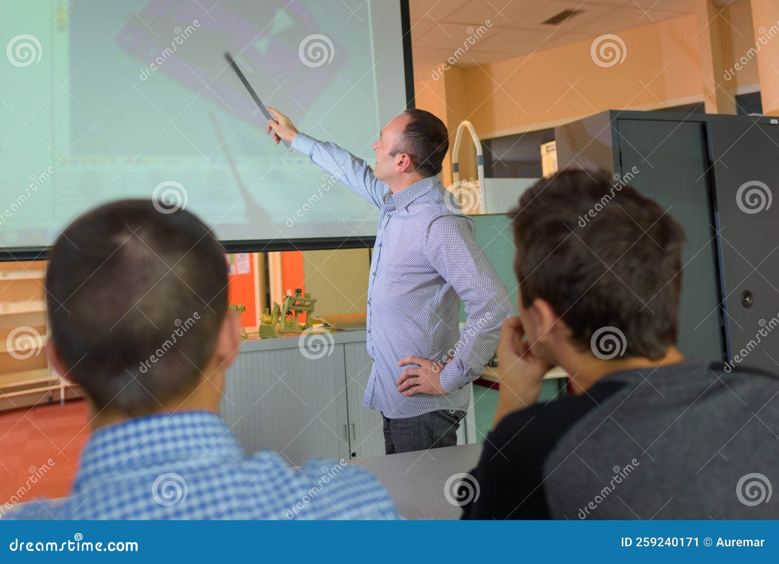 Teacher Pointing To Image on Projected Screen Stock Image - Image of ...