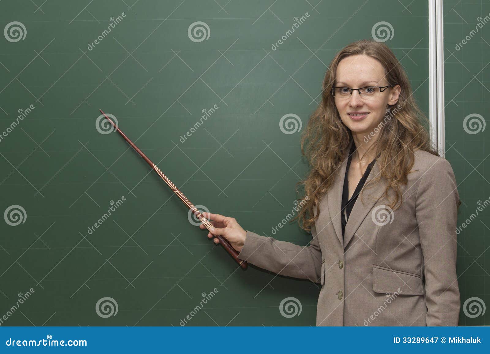 Teacher is Pointing To Something on the Board Stock Image - Image of ...