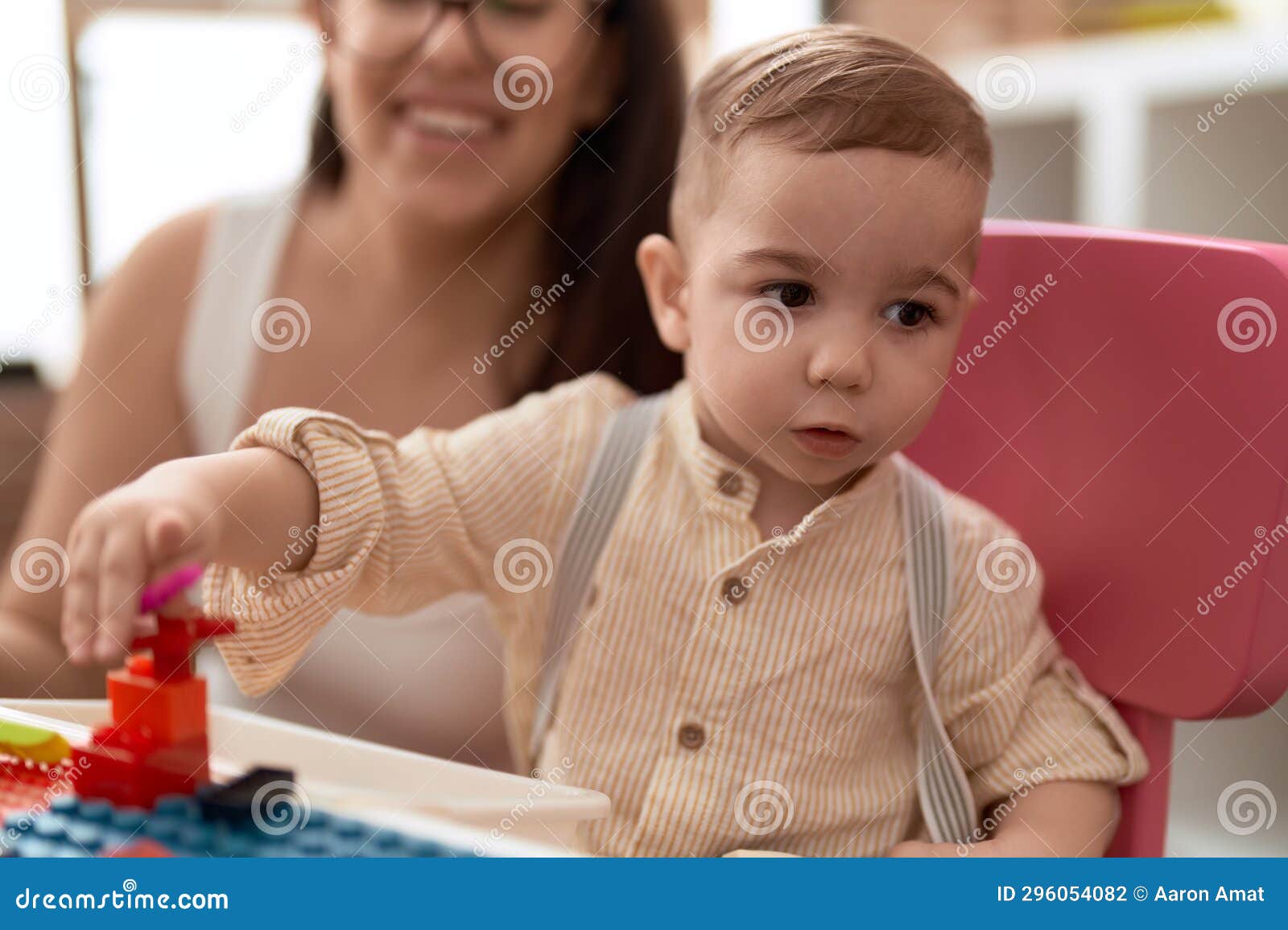 Teacher and Preschool Student Playing with Construction Blocks Sitting ...