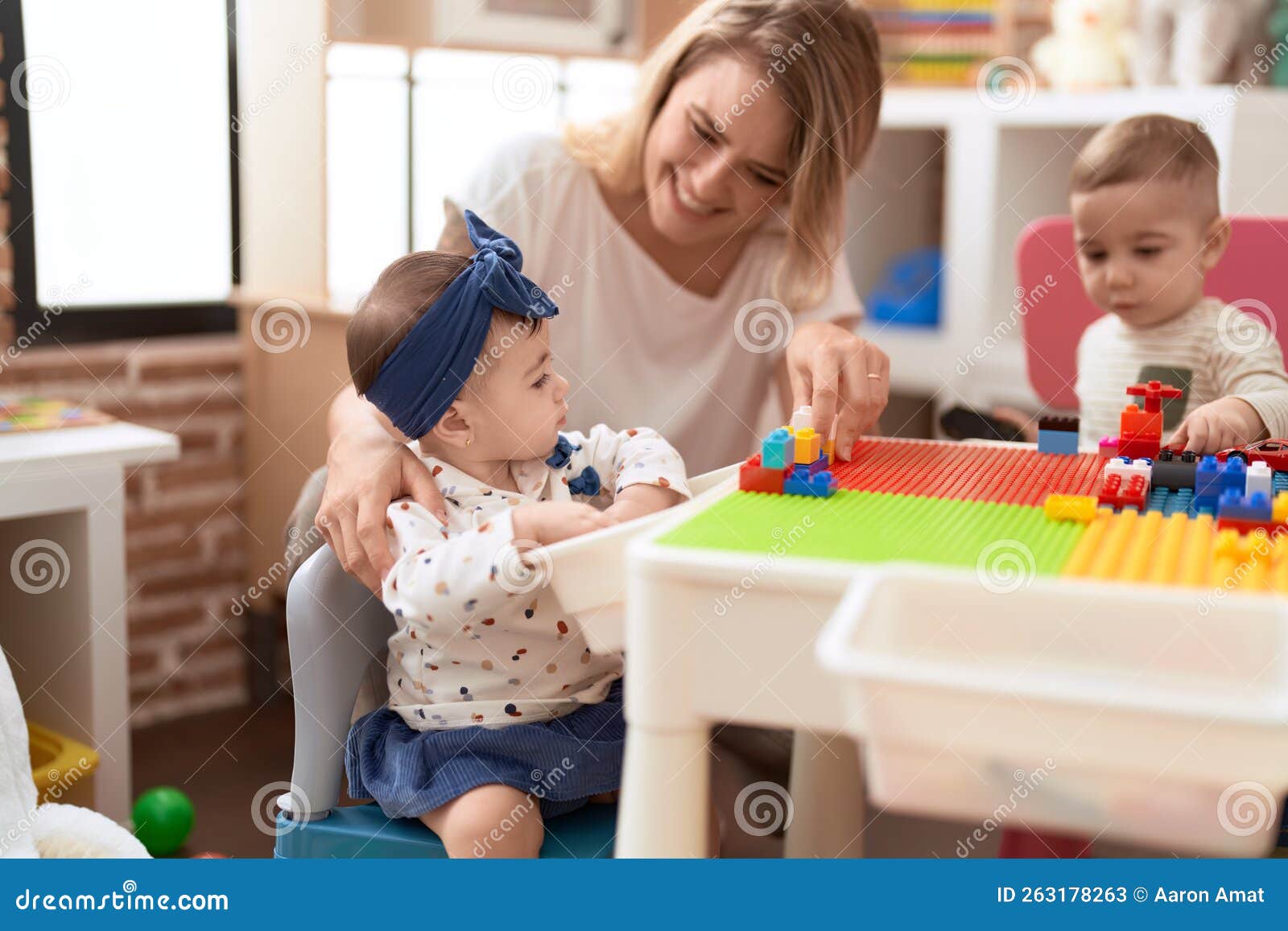 Teacher and Preschool Students Playing with Construction Blocks Sitting ...