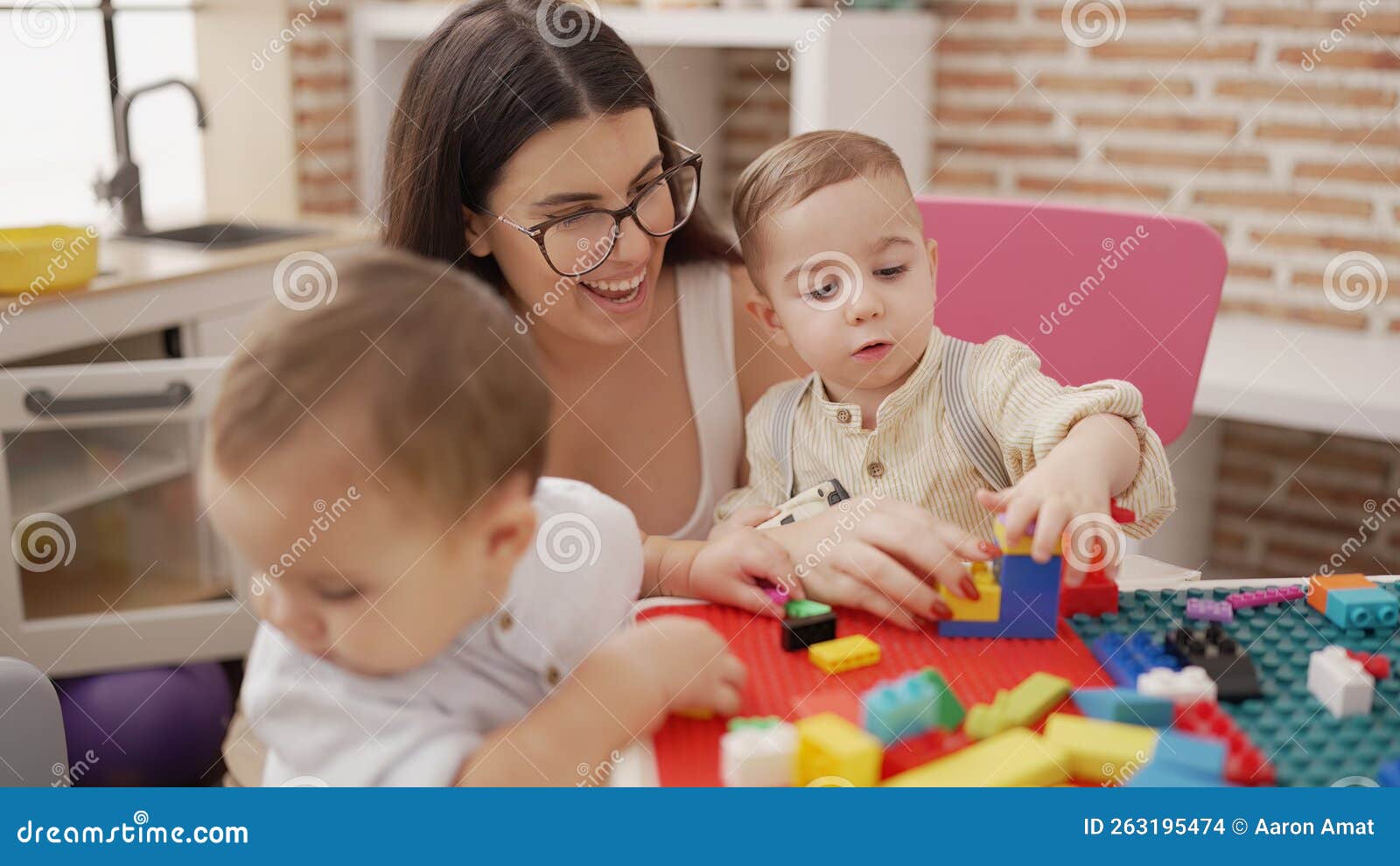 Teacher and Preschool Students Playing with Construction Blocks Sitting ...