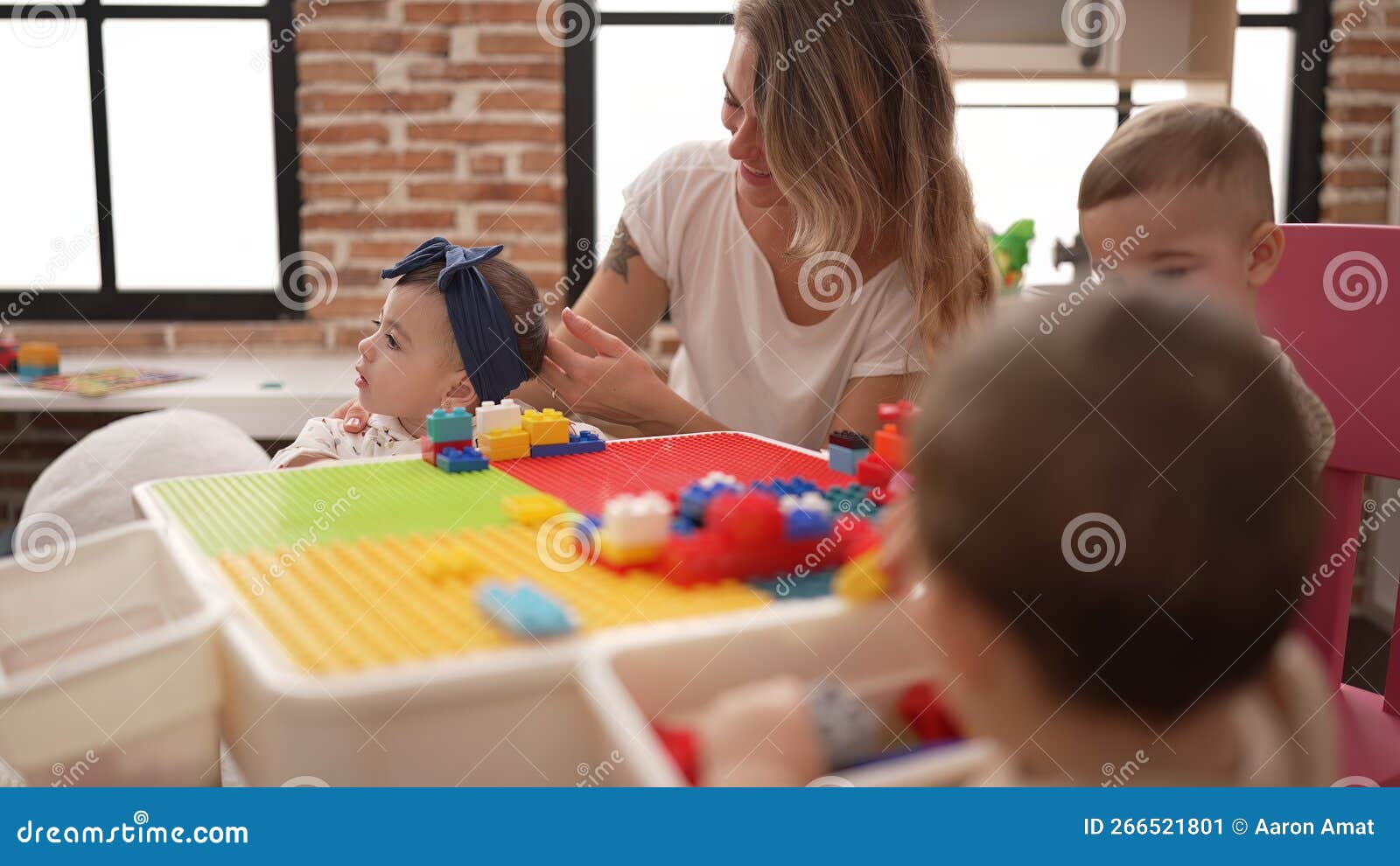 Teacher and Preschool Students Playing with Construction Blocks Sitting ...