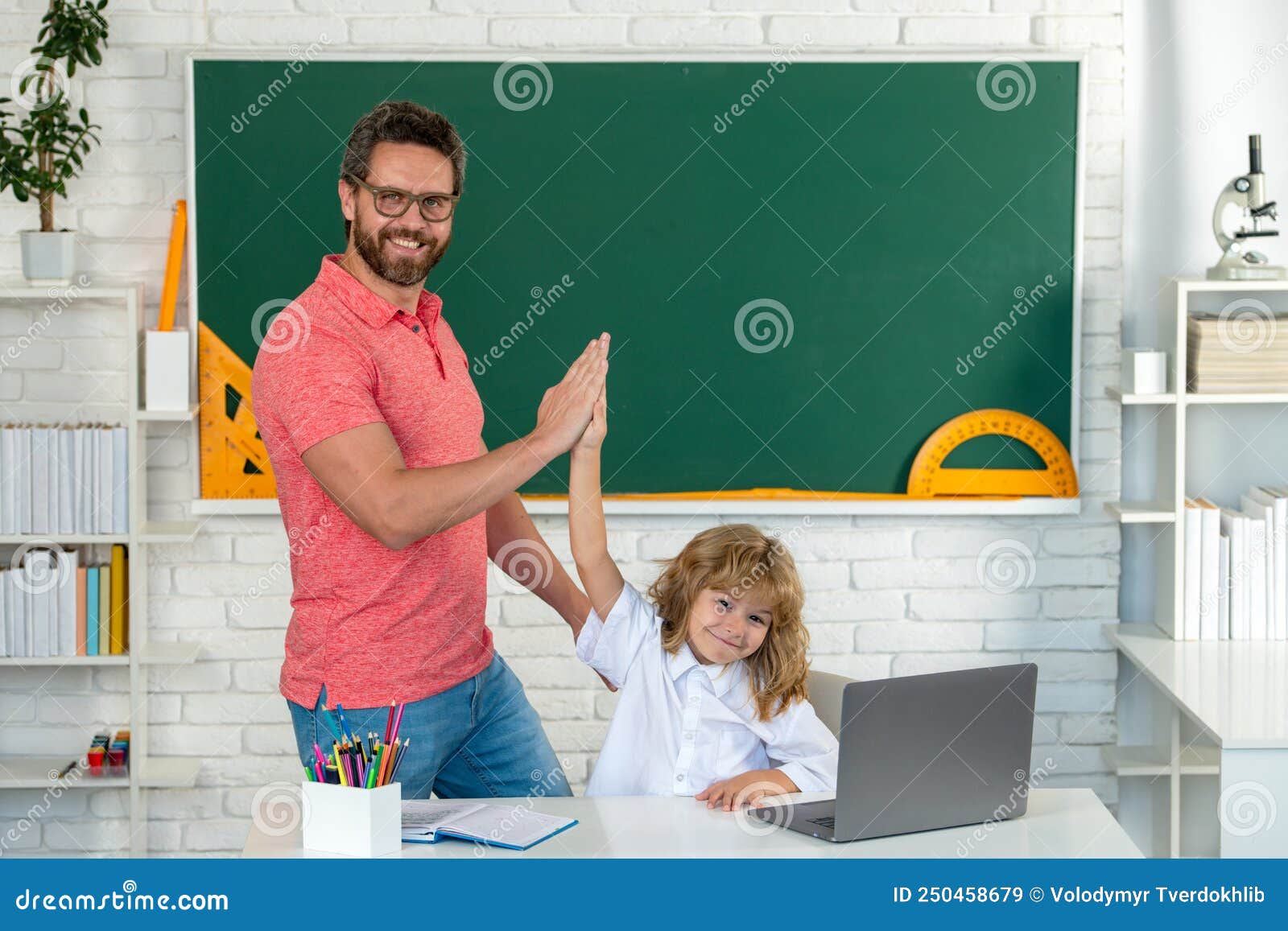 Teacher and Pupil Boy Learning in the Classroom. Stock Image - Image of ...