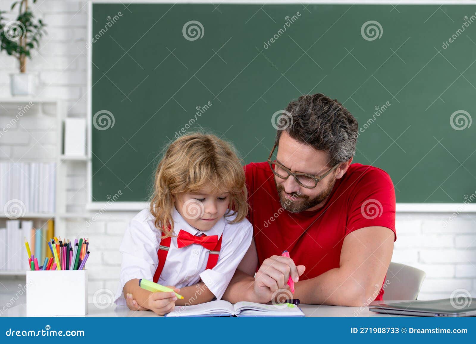 Teacher and Pupil Boy Learning in the Classroom. Education and ...