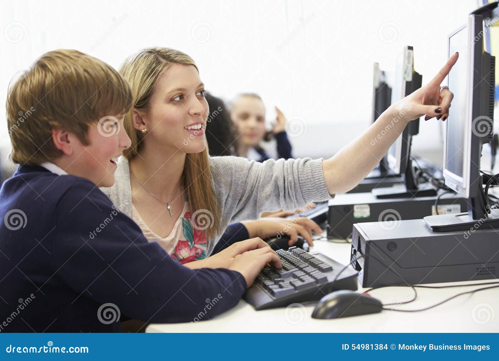 Teacher and Pupil in School Computer Class Stock Photo - Image of ...