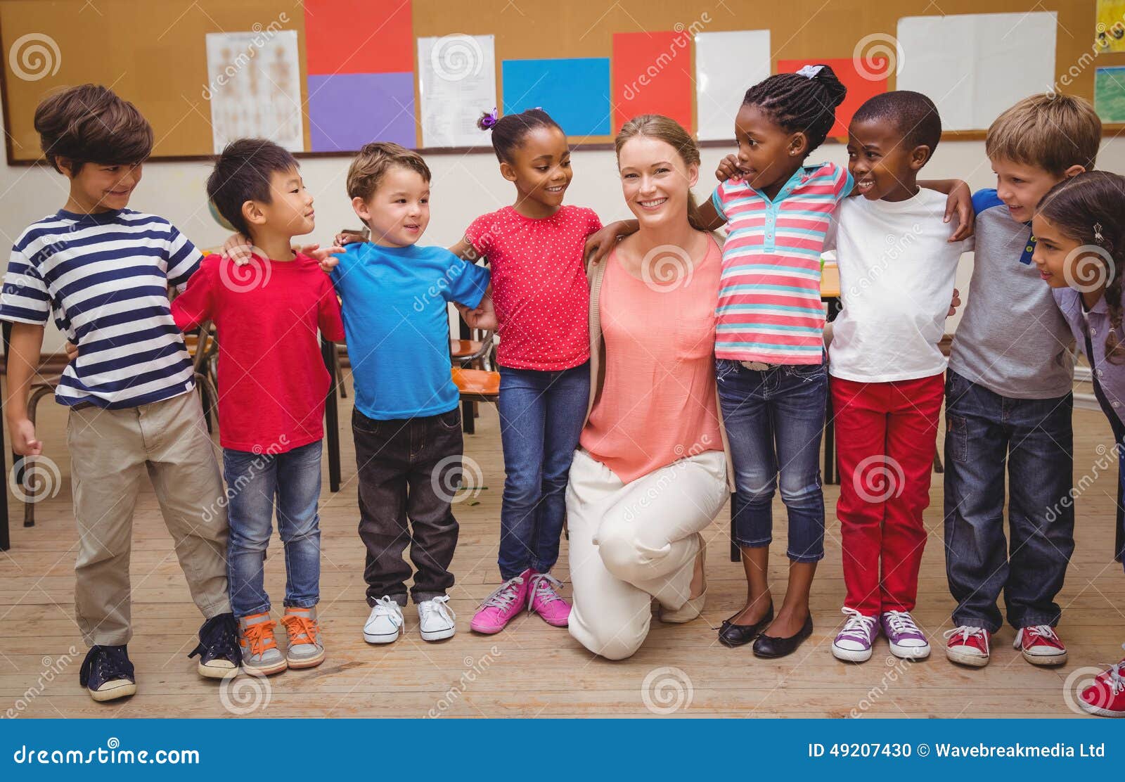 Teacher and Pupils Smiling at Camera in Classroom Stock Photo - Image ...