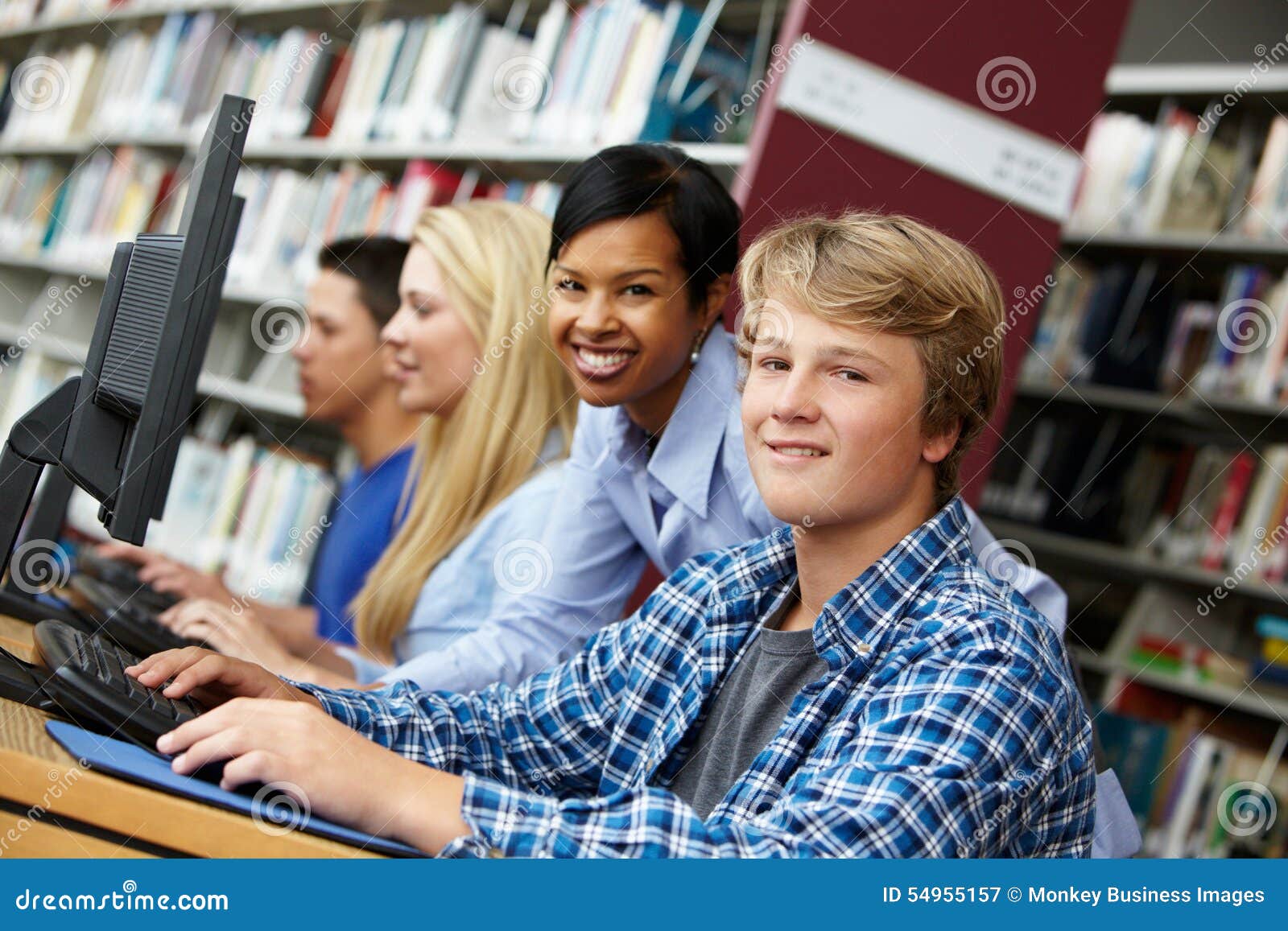 Teacher and Pupils Working on Computers Stock Image - Image of ...