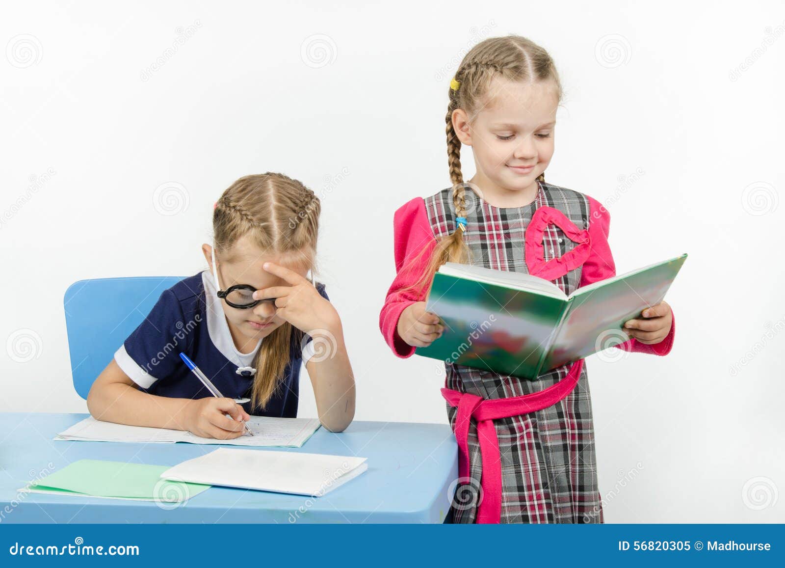 The Teacher Reads the Student Assignment Stock Image - Image of ...