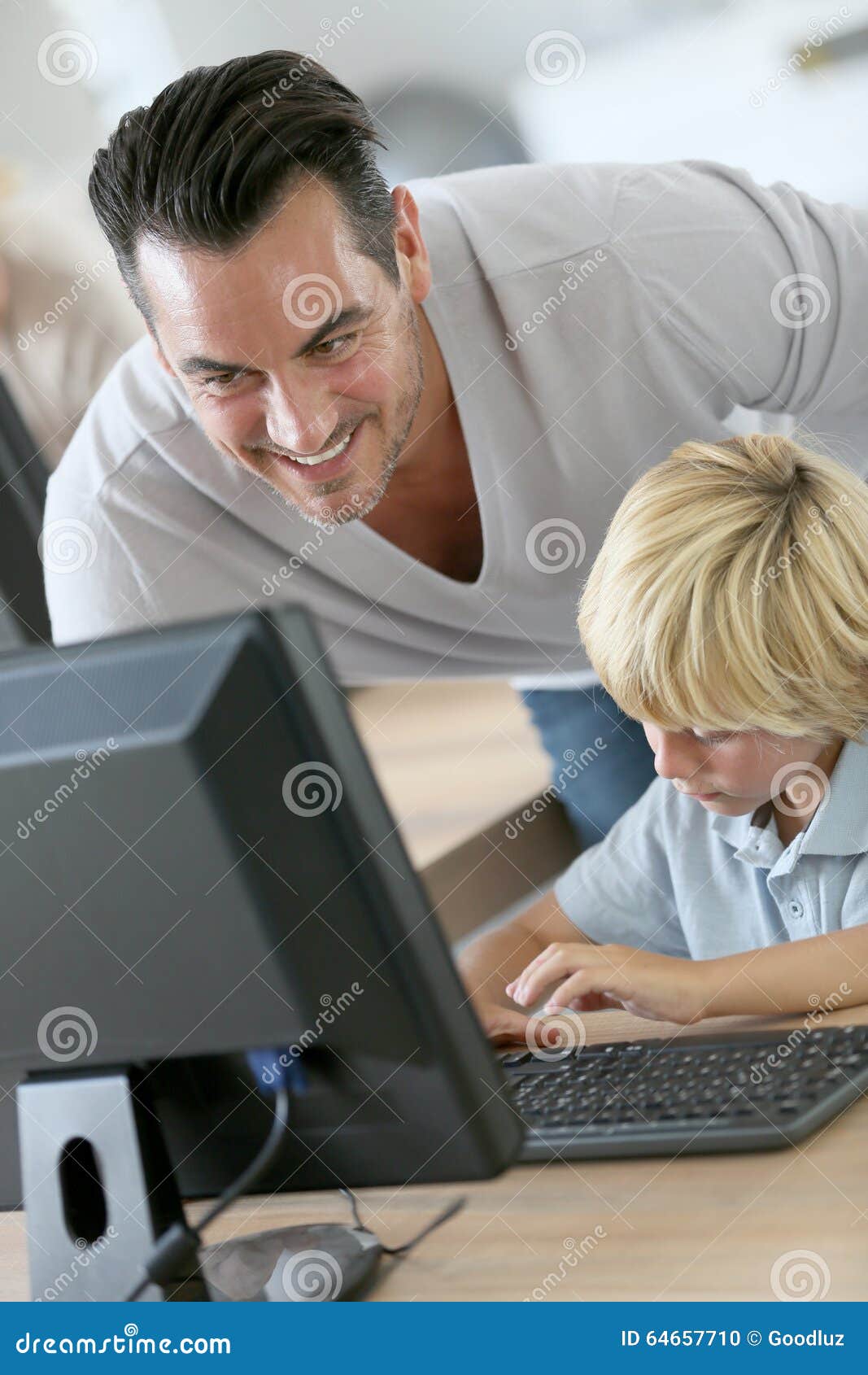 Teacher with School Boy on Desktop Computer Stock Photo - Image of ...