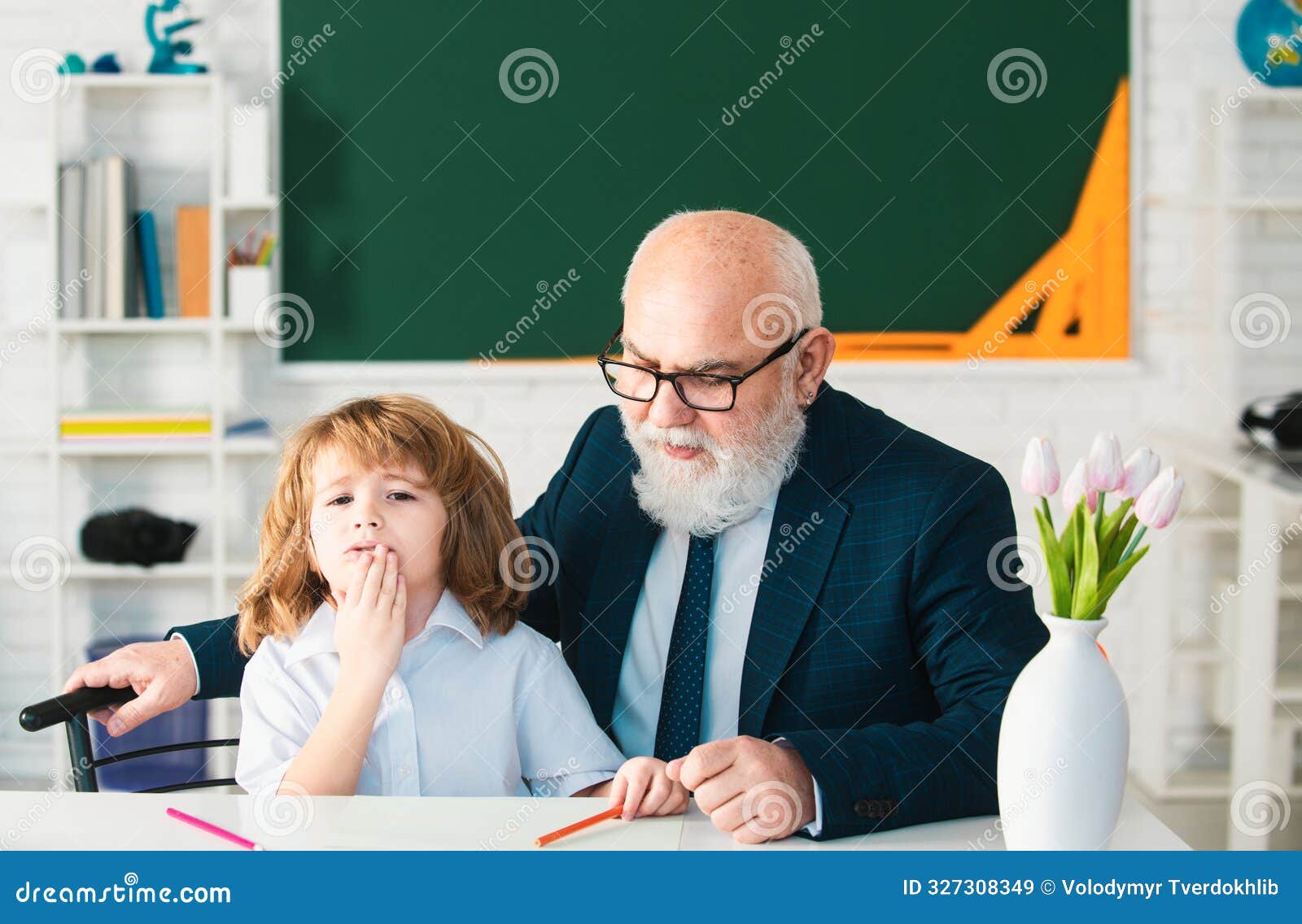 Teacher and School Boy Doing Homework Assignment at School. Stock Image ...