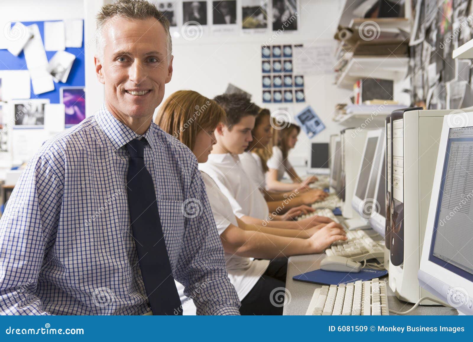 Teacher and Schoolchildren Studying on Computers Stock Image - Image of ...