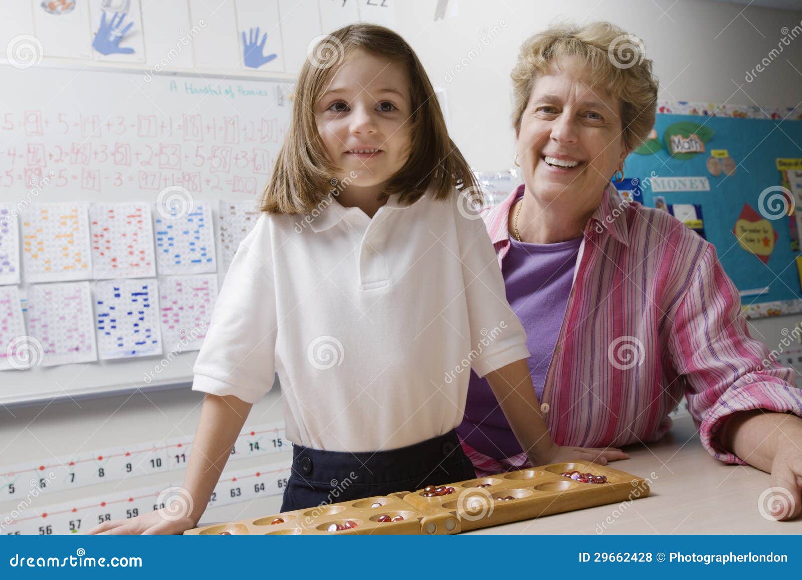 Teacher and Schoolgirl with Counting Tray Stock Photo - Image of ...