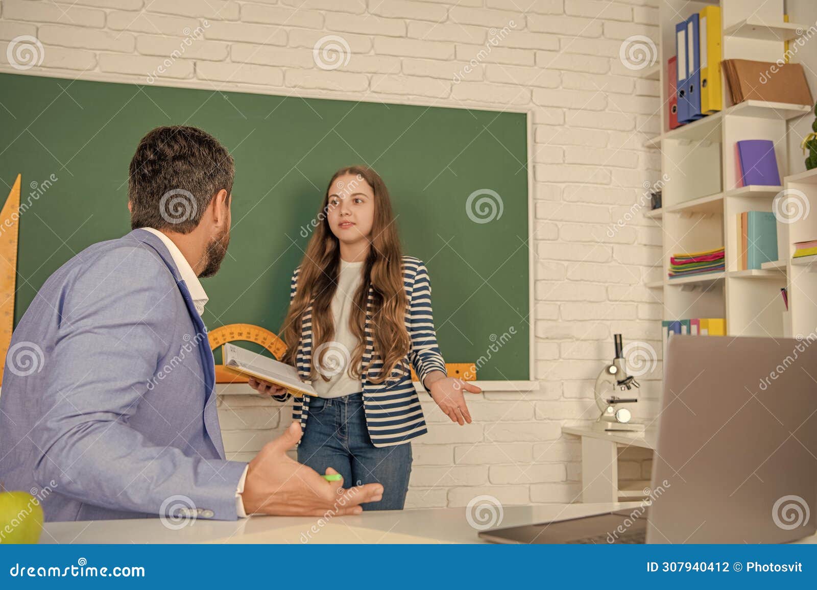 Teacher with Selective Focus of Child at Blackboard Stock Photo - Image ...