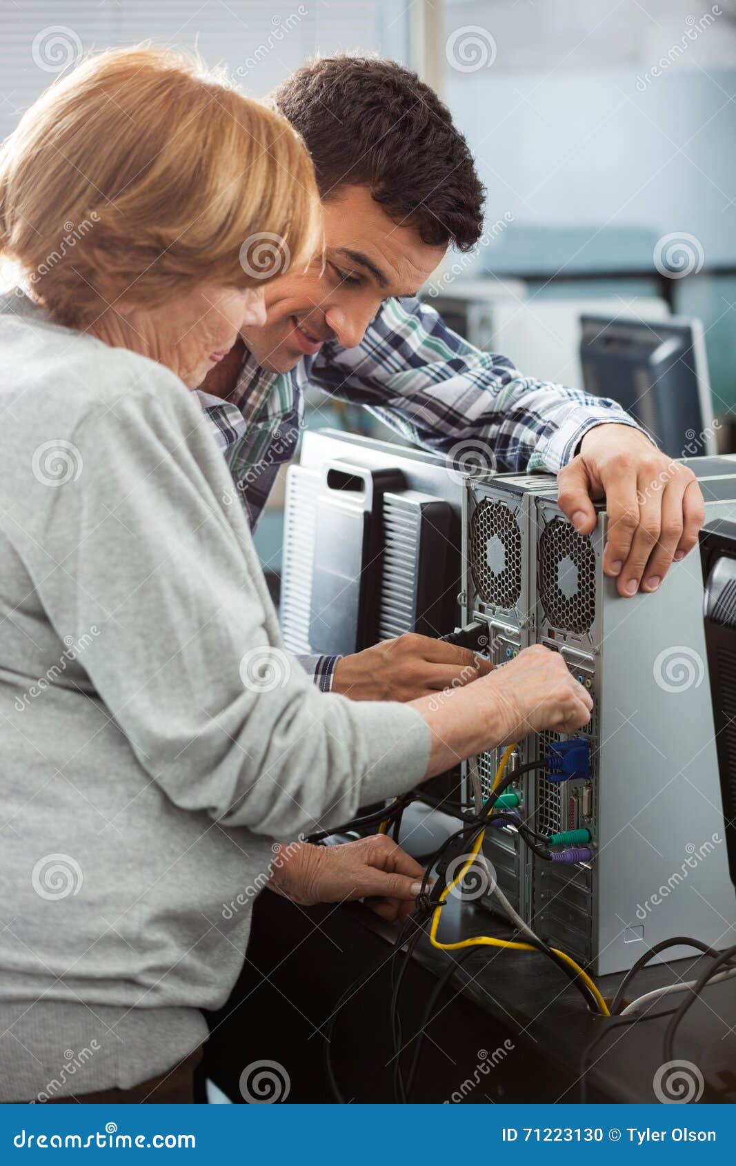 Teacher and Senior Student Setting Up Computer Stock Photo - Image of ...