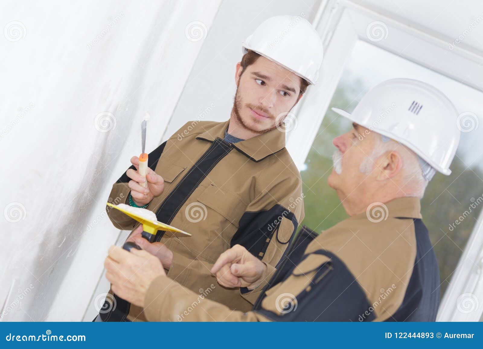 Teacher Showing Apprentice How To Float Cement Stock Image - Image of ... Teacher Showing Apprentice How To Float Cement Stock Image - Image of ...