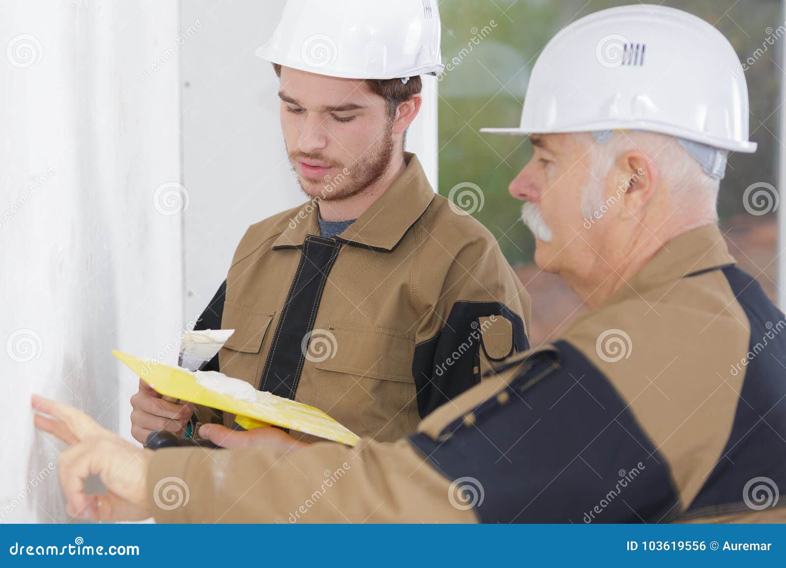 Teacher Showing Apprentice How To Plaster Wall Stock Photo - Image of ... Teacher Showing Apprentice How To Plaster Wall Stock Photo - Image of ...