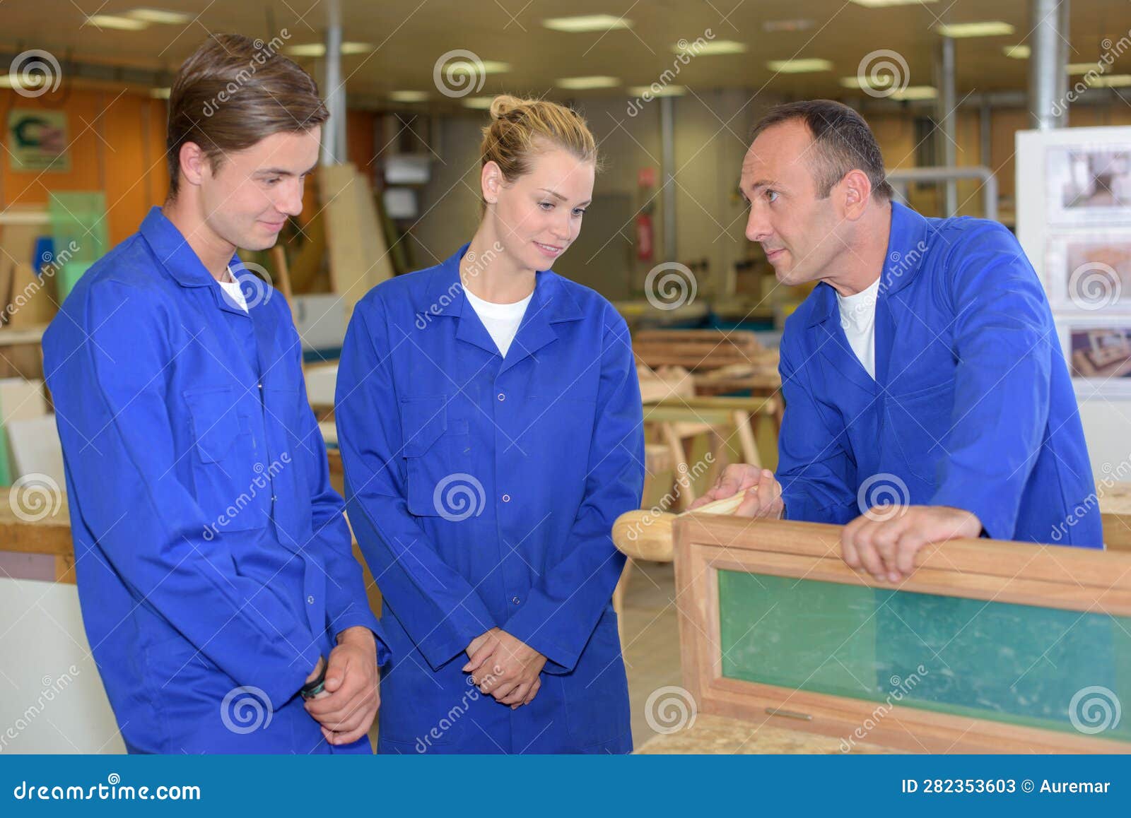 Teacher Showing Example To Apprentices Stock Image - Image of show ...