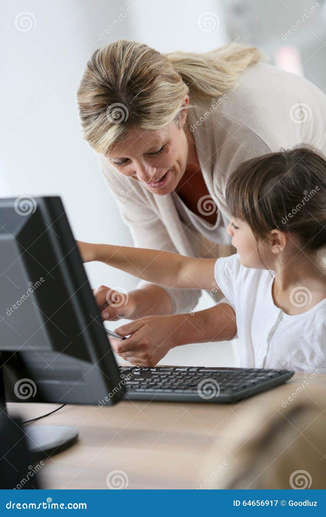 Teacher Showing Little Girl How To Use Computer Stock Image - Image of ...