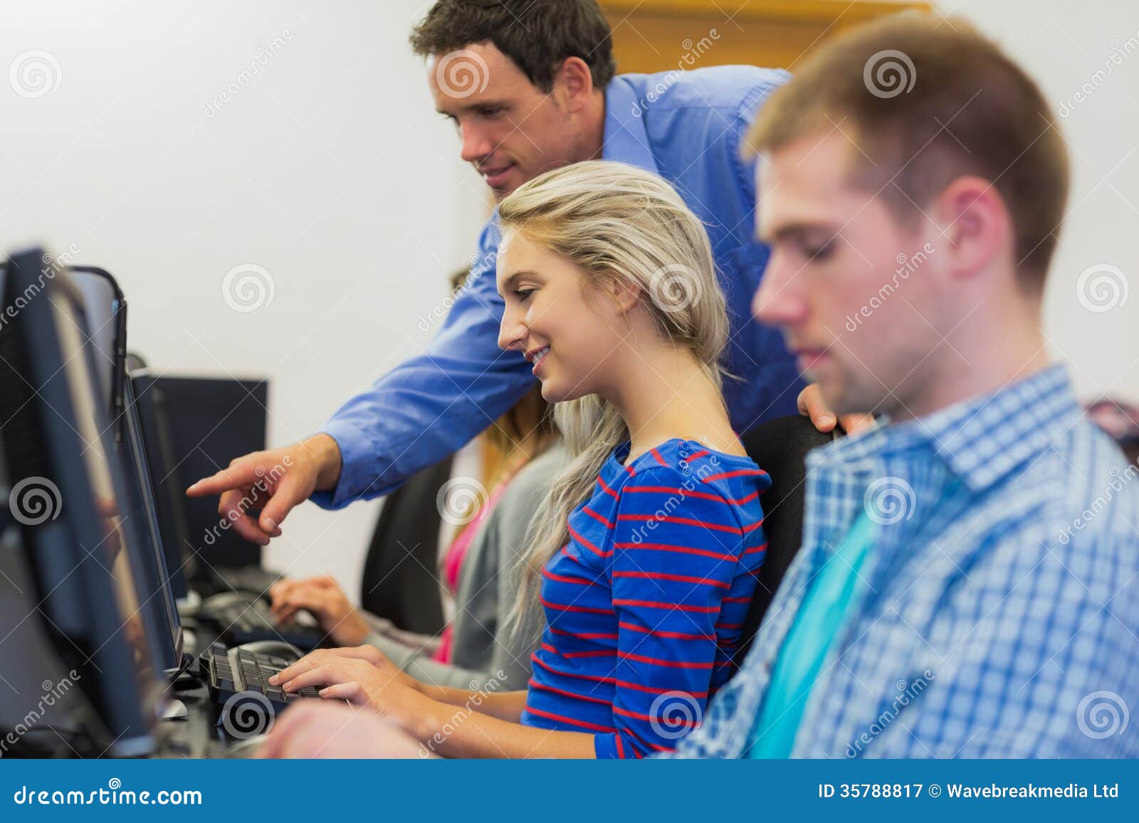 Teacher Showing Something on Screen To Student in Computer Room Stock ...