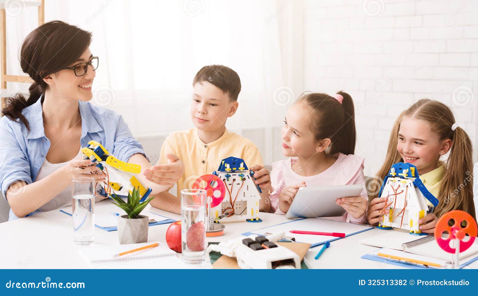 Teacher Showing Students How To Build a Model Robot Stock Photo - Image ...