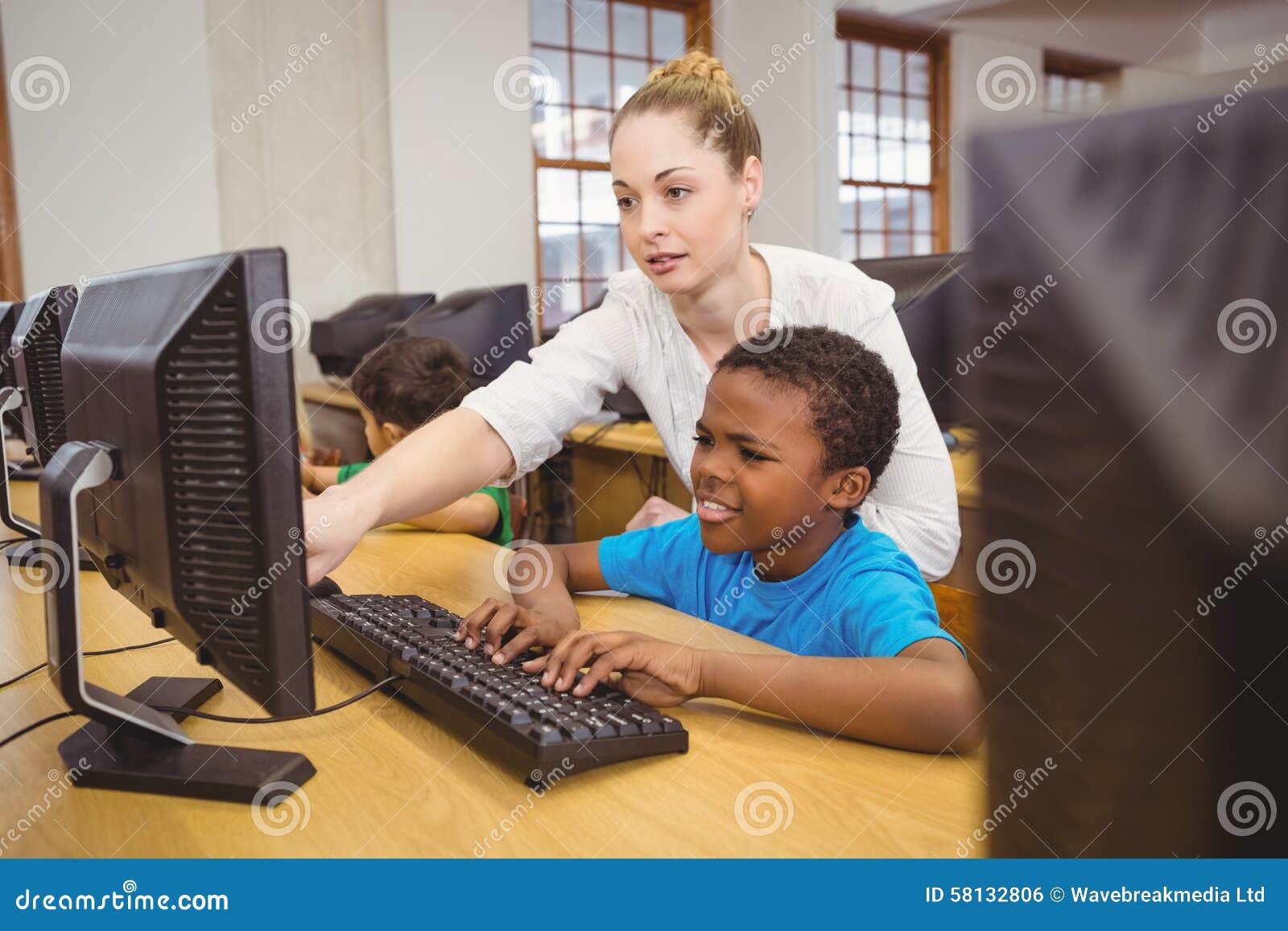 Teacher Showing Students How To Use a Computer Stock Photo - Image of ...