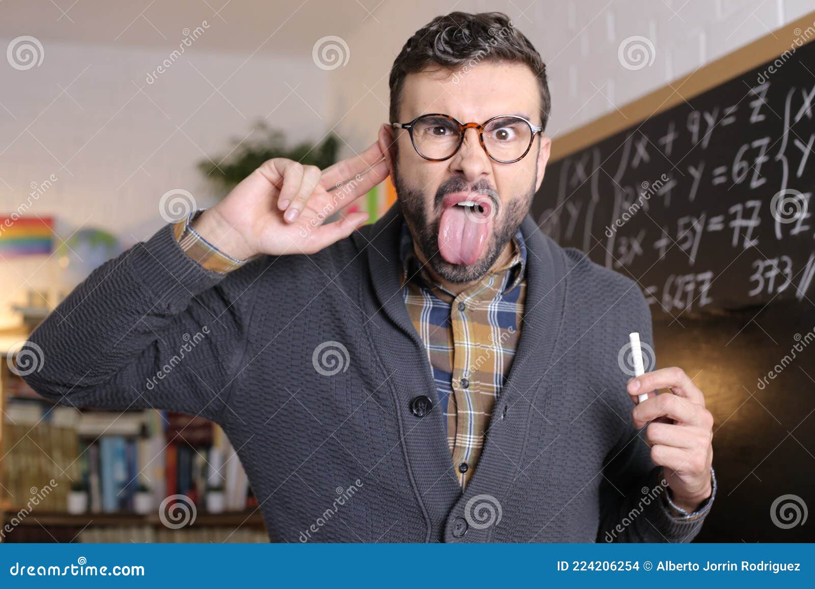 Teacher Showing Ugly Face in Classroom Stock Photo - Image of grimacing ...