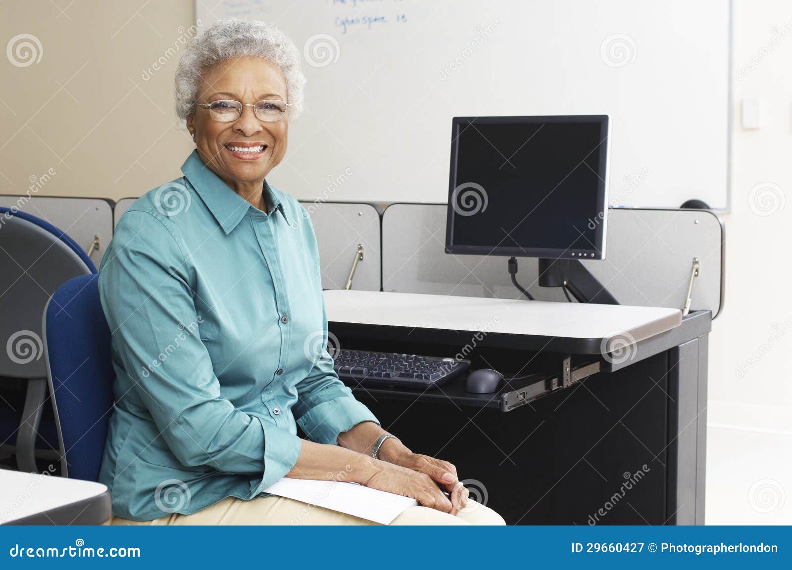 Teacher Sitting in Classroom Stock Image - Image of american ...