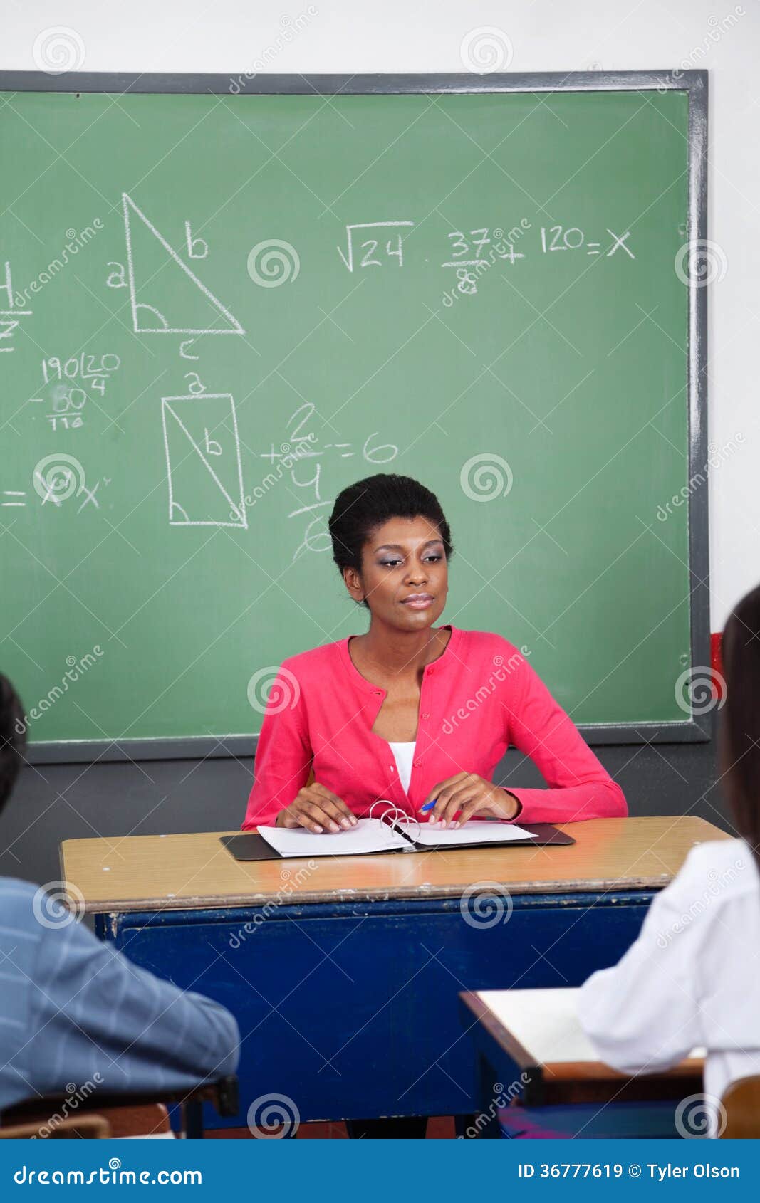 Teacher Sitting at Desk with Students in Stock Image - Image of people ...